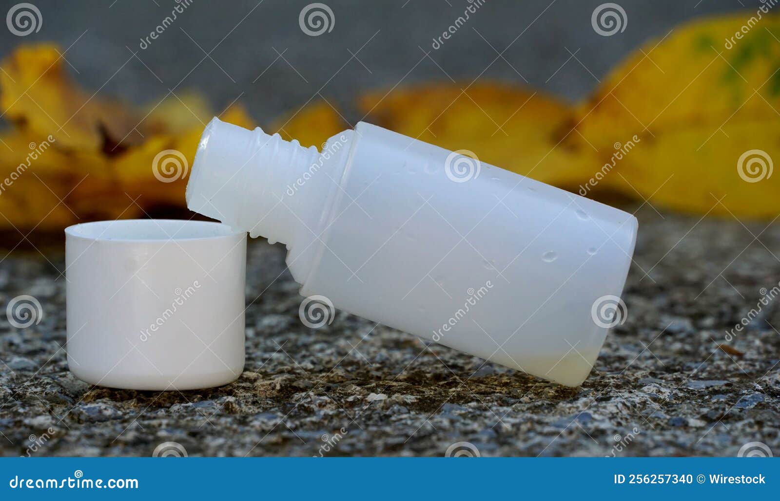 Closeup of a Small Plastic Bottle on an Asphalt Stock Photo - Image of ...