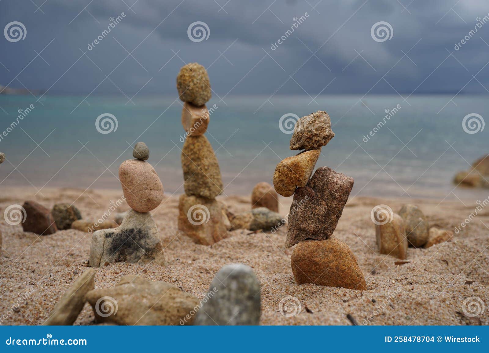 Closeup of Small Rocks Stacked on Top of Each Other on the Shore of a ...