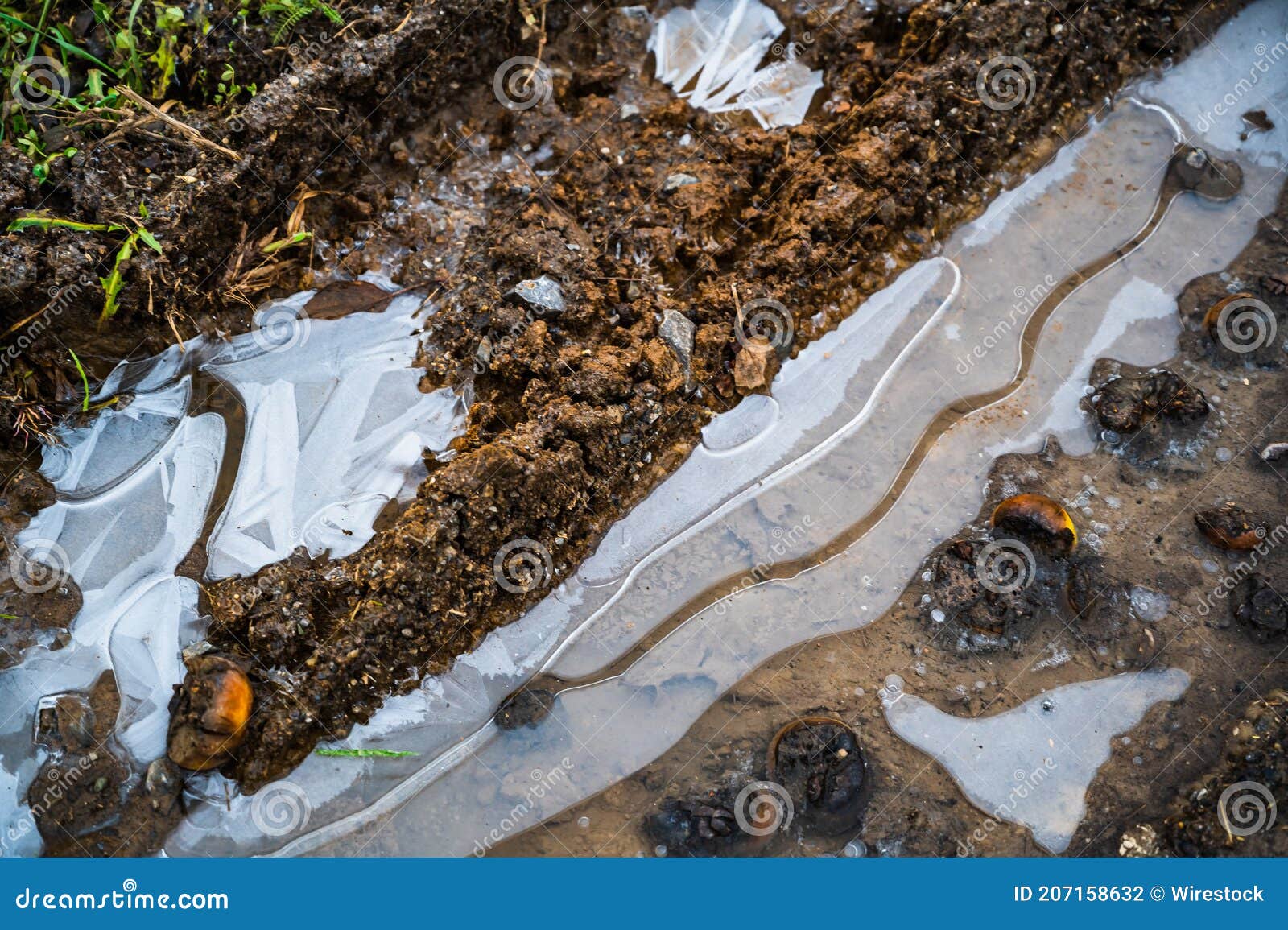 Closeup of the Soil Covered in Frozen Ice in the Morning Stock Photo ...