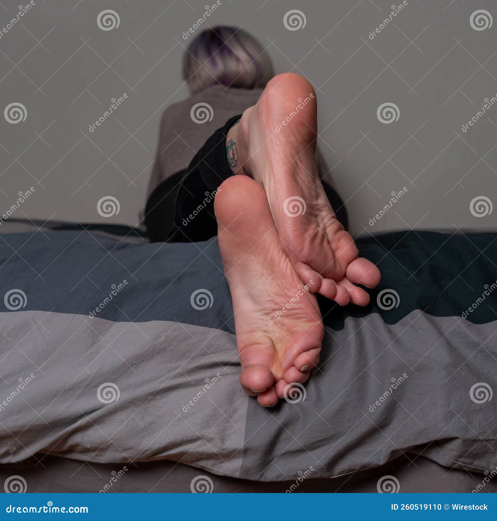 Closeup of the Soles of Female Feet Lying in a Bed Stock Photo - Image ... Closeup of the Soles of Female Feet Lying in a Bed Stock Photo - Image ...