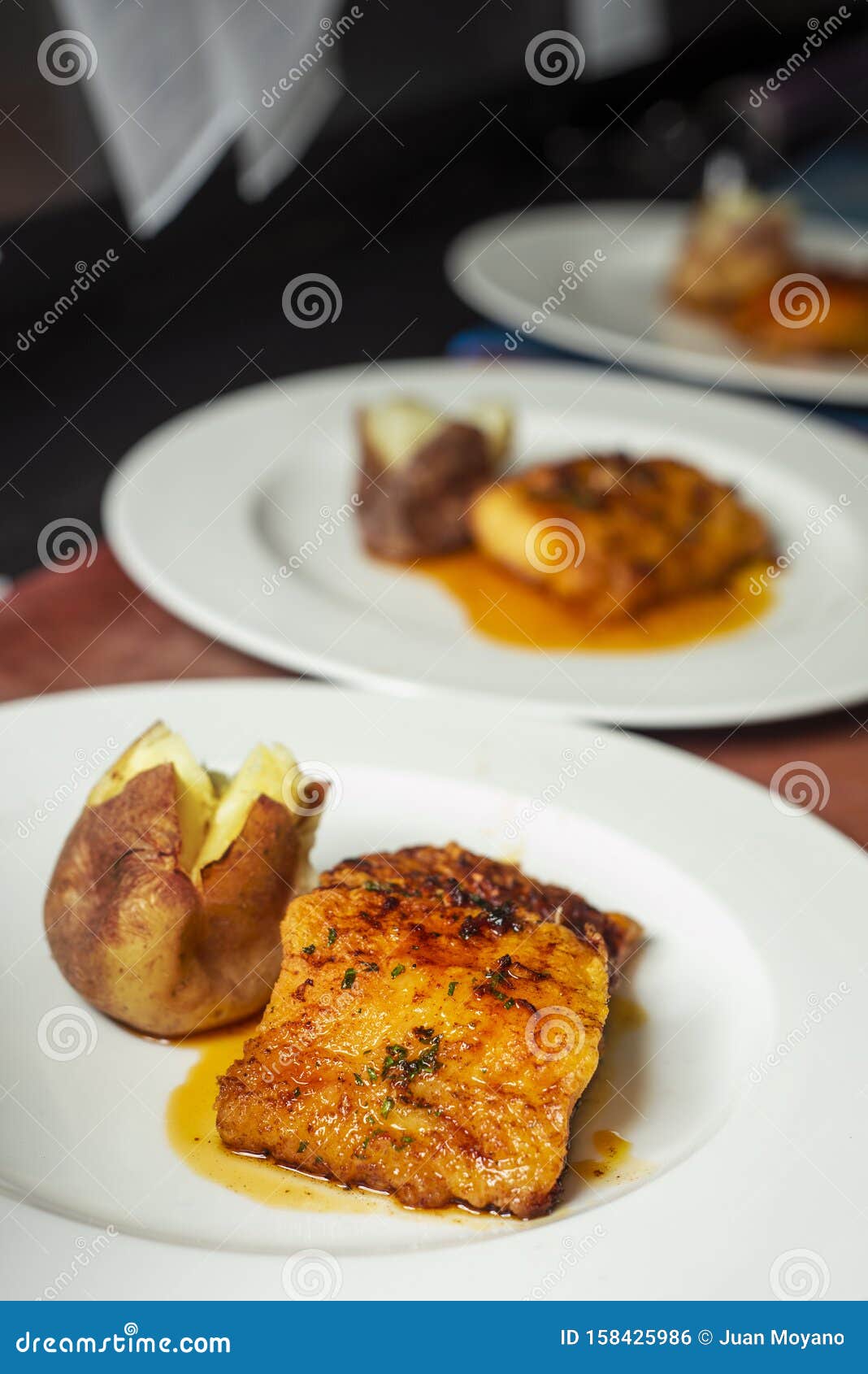 Plates with Battered Cod and Roasted Potatoes Stock Photo - Image of ...