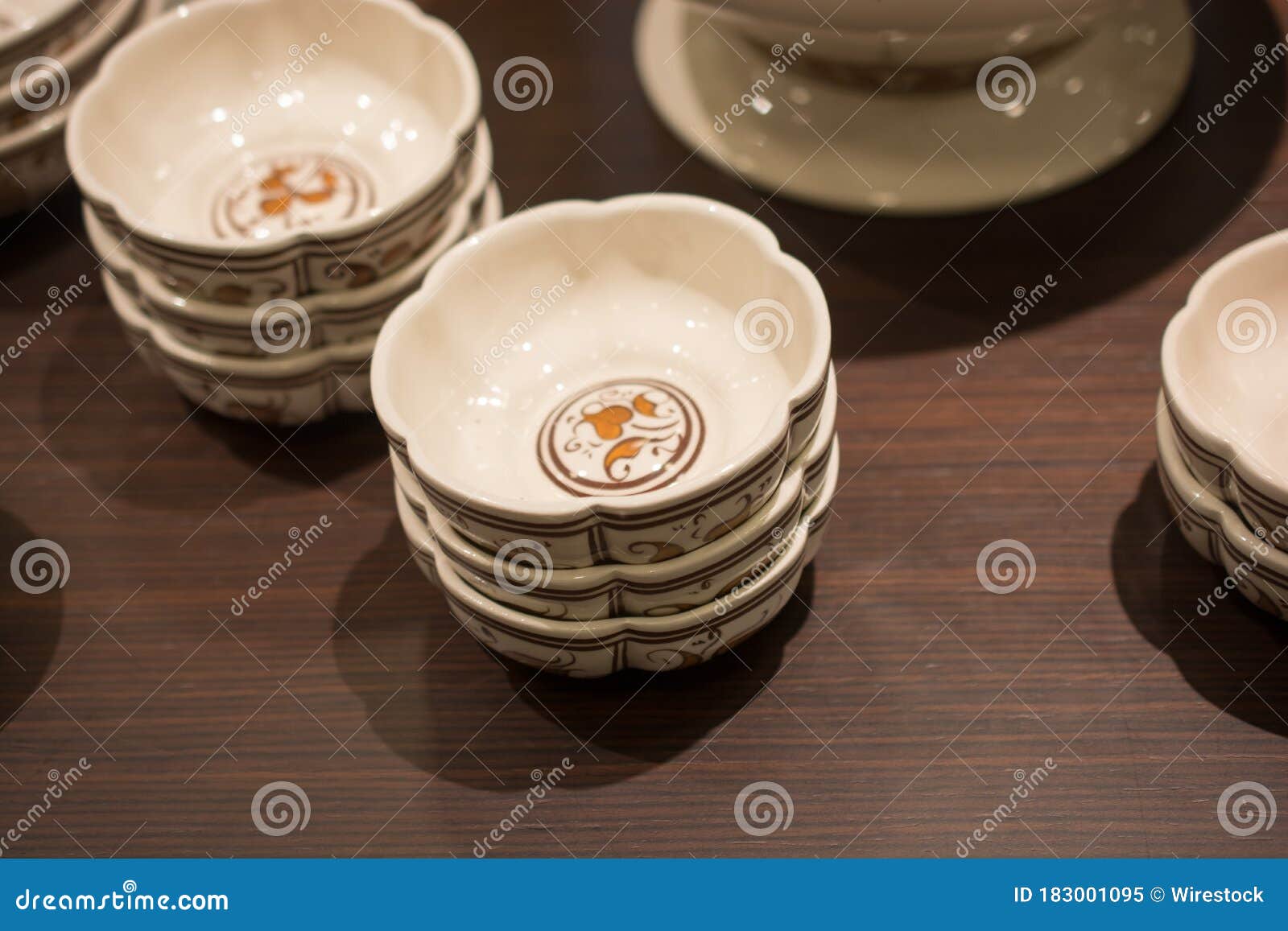 Closeup of Stack of Ceramic Bowls on a Wooden Table Stock Image - Image ...