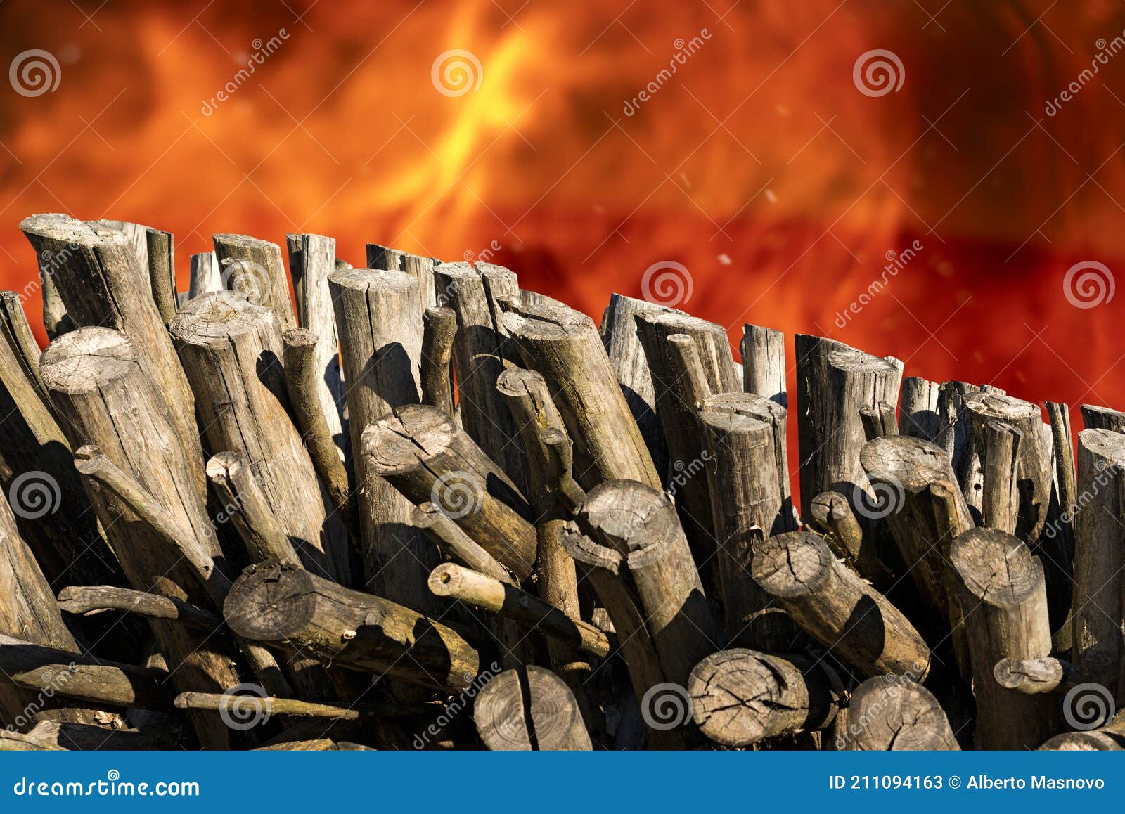 Stack of Firewood with Flames of a Bonfire on Background Stock Image ...