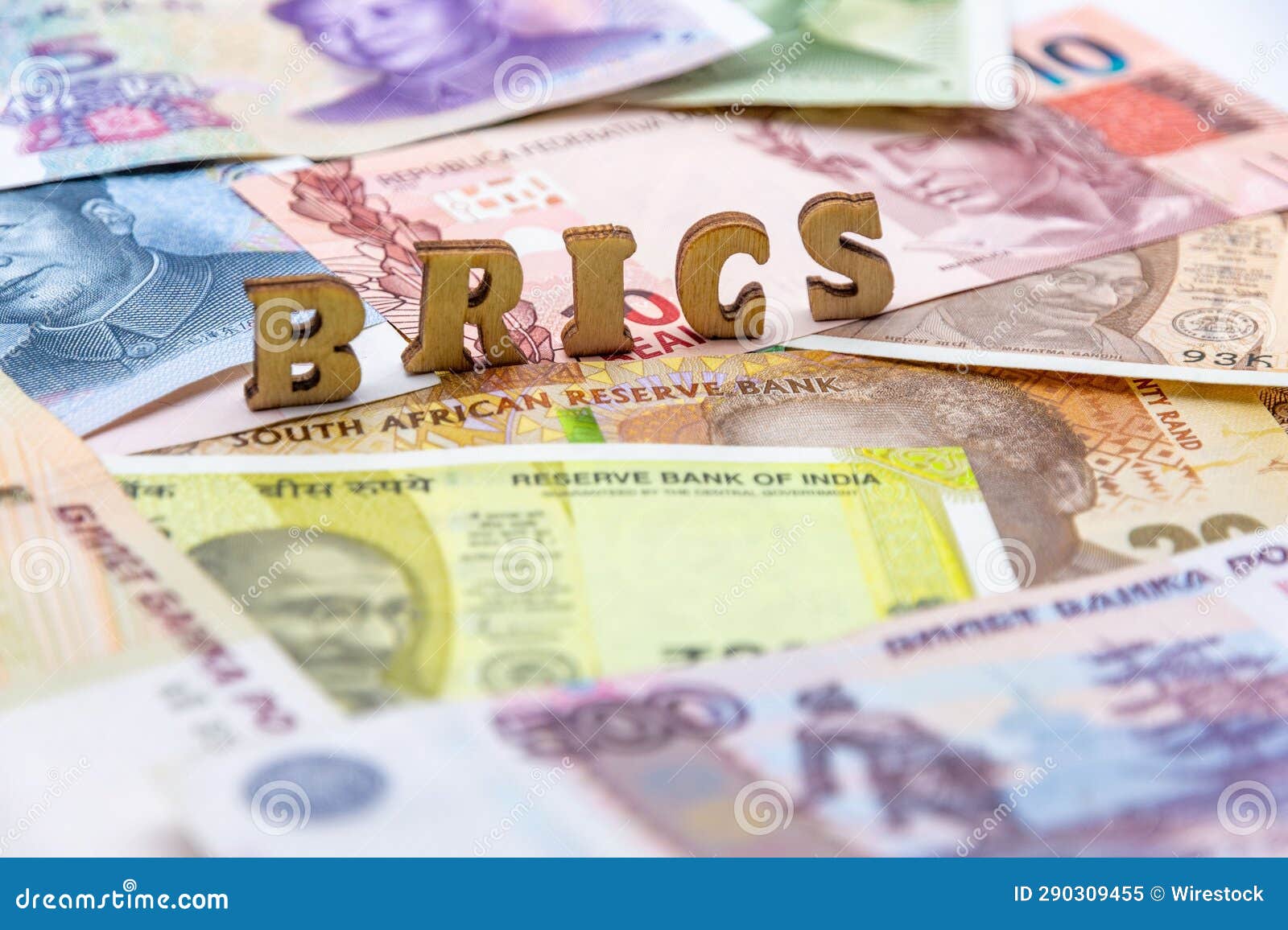 Closeup of a Stack of Various Currency Banknotes with the Letters BRICS ...