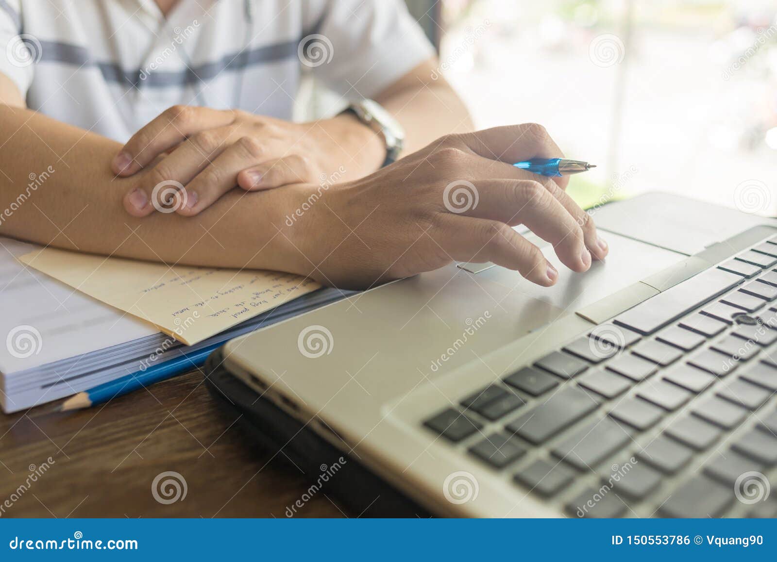 Closeup of Human Hand Holding Pen and Using Laptop Touchpad Stock Photo ...
