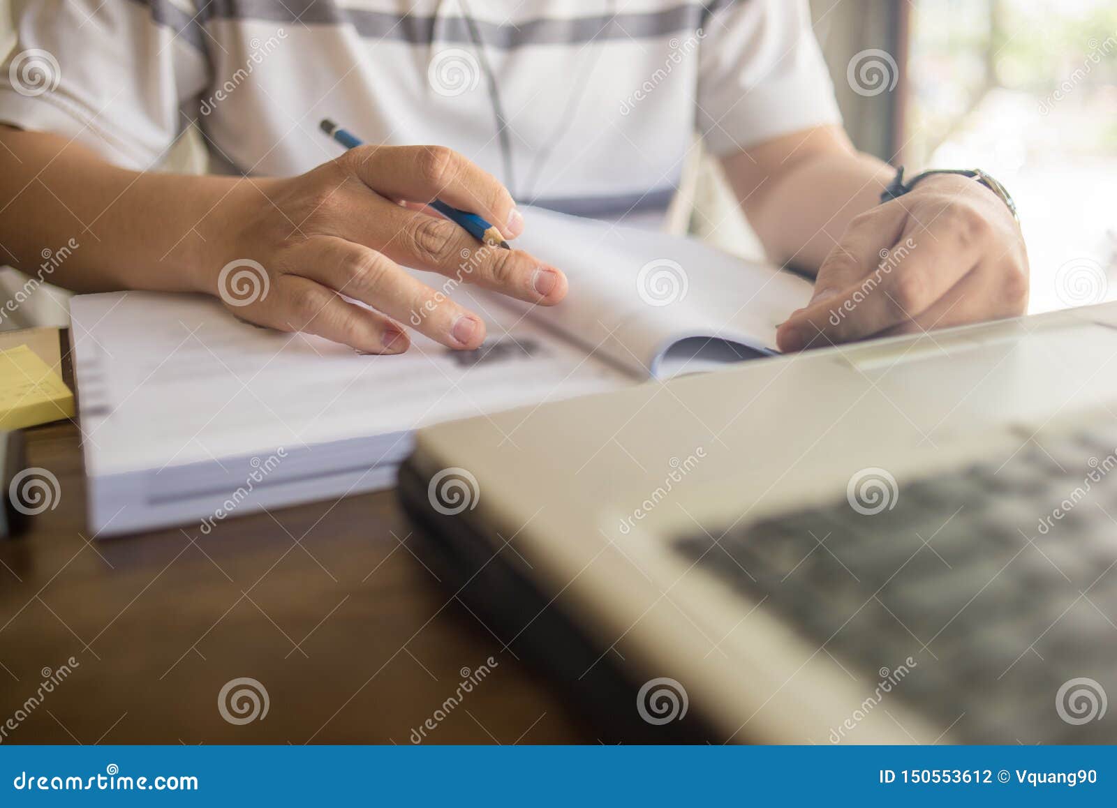 Closeup of Student Hand Using Pen while Studying on Workbook Stock ...