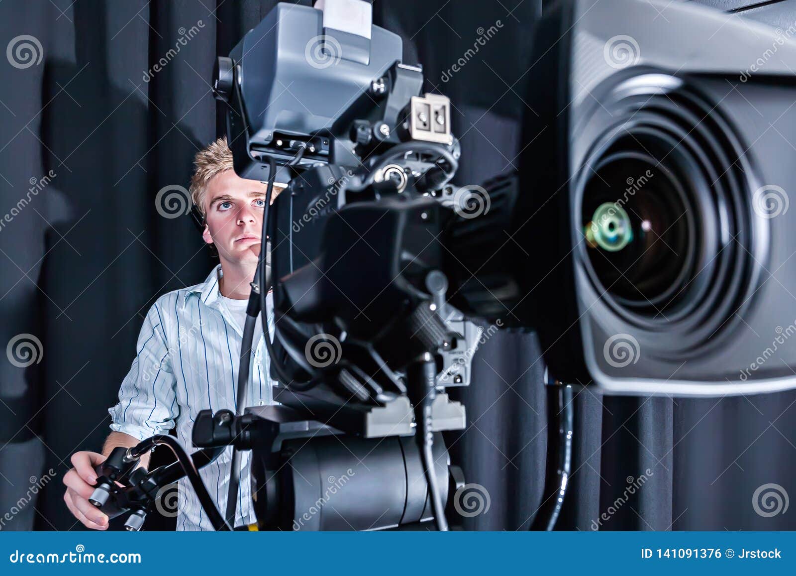 Closeup of a Studio Camera Front with a Guy Stock Photo - Image of ...