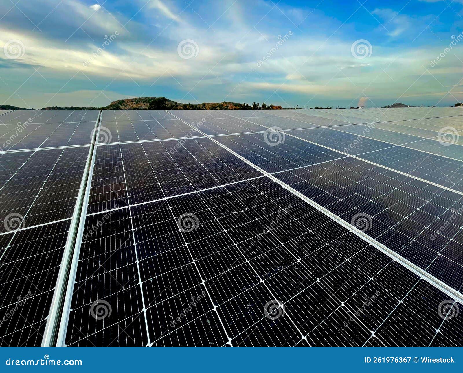 Closeup of Symmetrical Solar Panels with Cloudy Sky on the Background ...