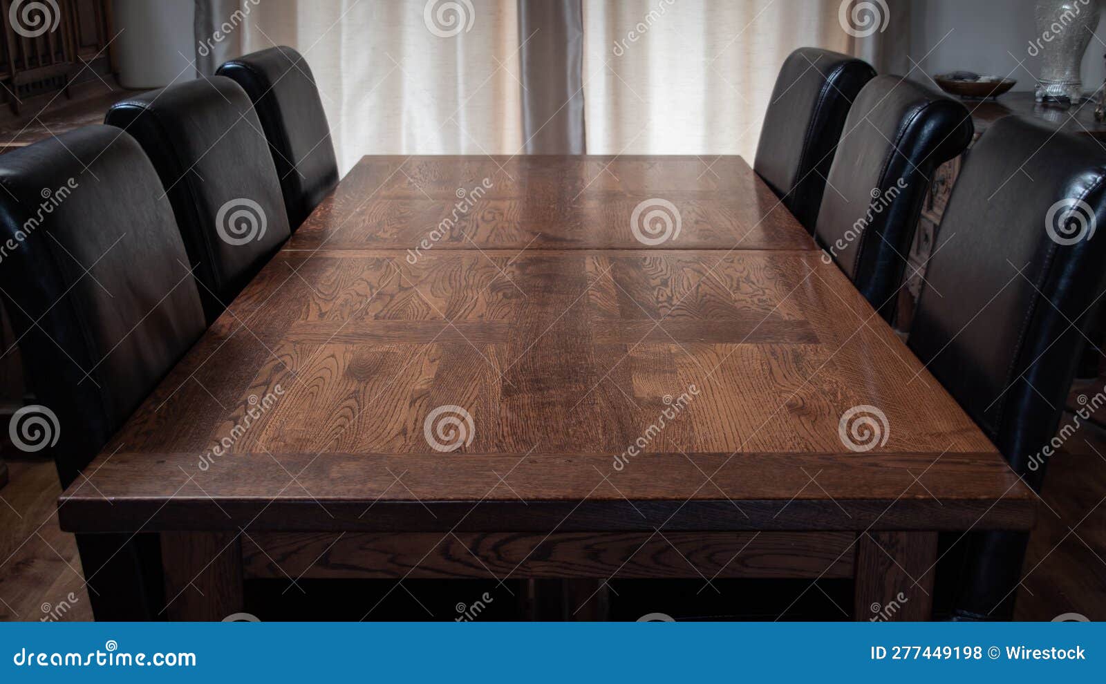 Closeup of a Table with Black Chairs Behind it Stock Photo - Image of ...