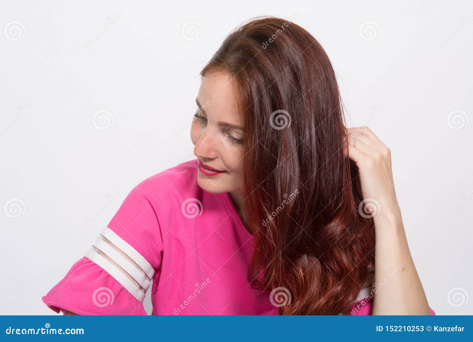 Closeup Of A Thoughtful Red-haired Woman Looking Away Isolated On White ... Closeup Of A Thoughtful Red-haired Woman Looking Away Isolated On White ...