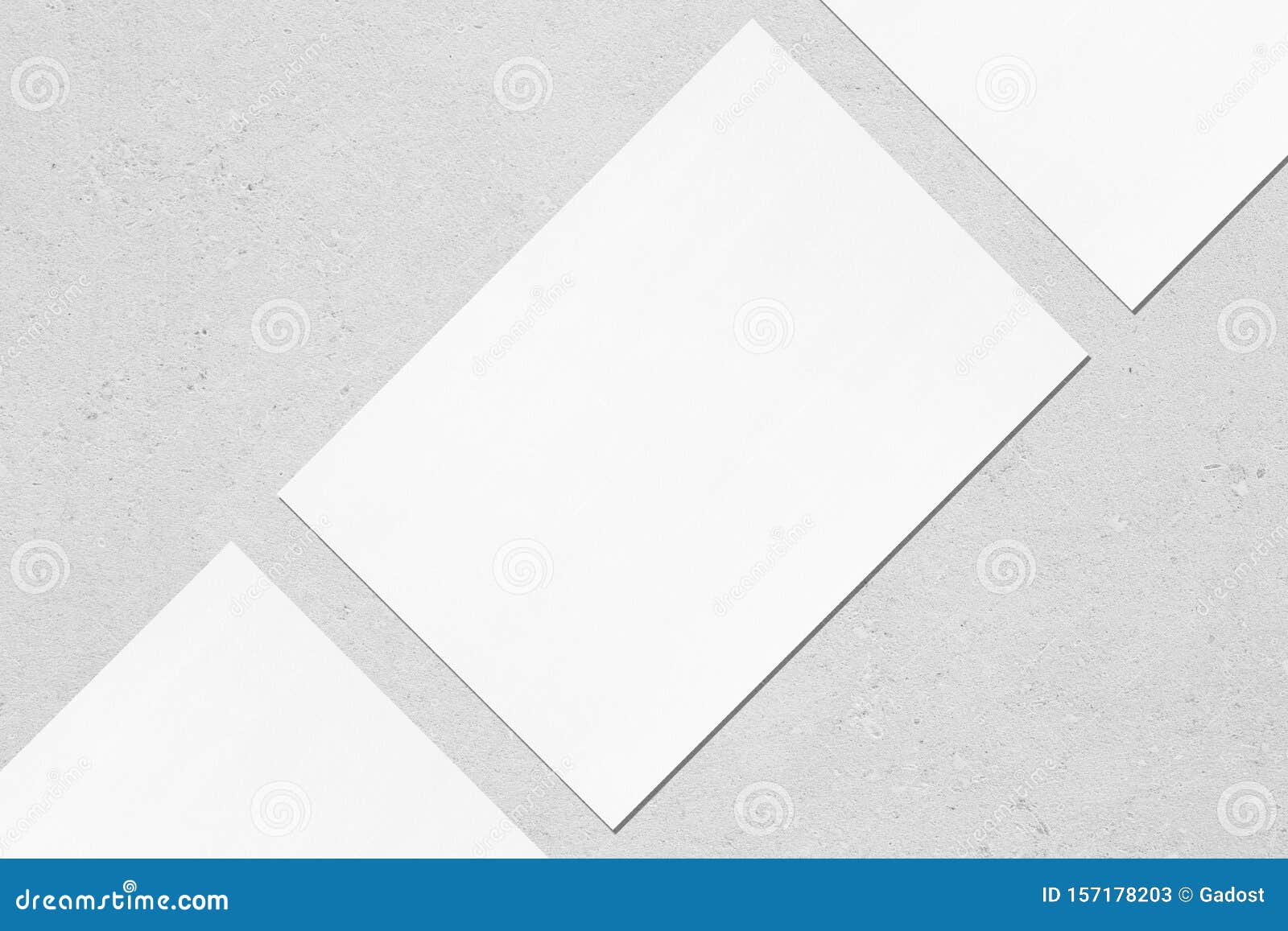 Closeup of Three Empty White Rectangle Poster Mockups Lying Diagonally ...