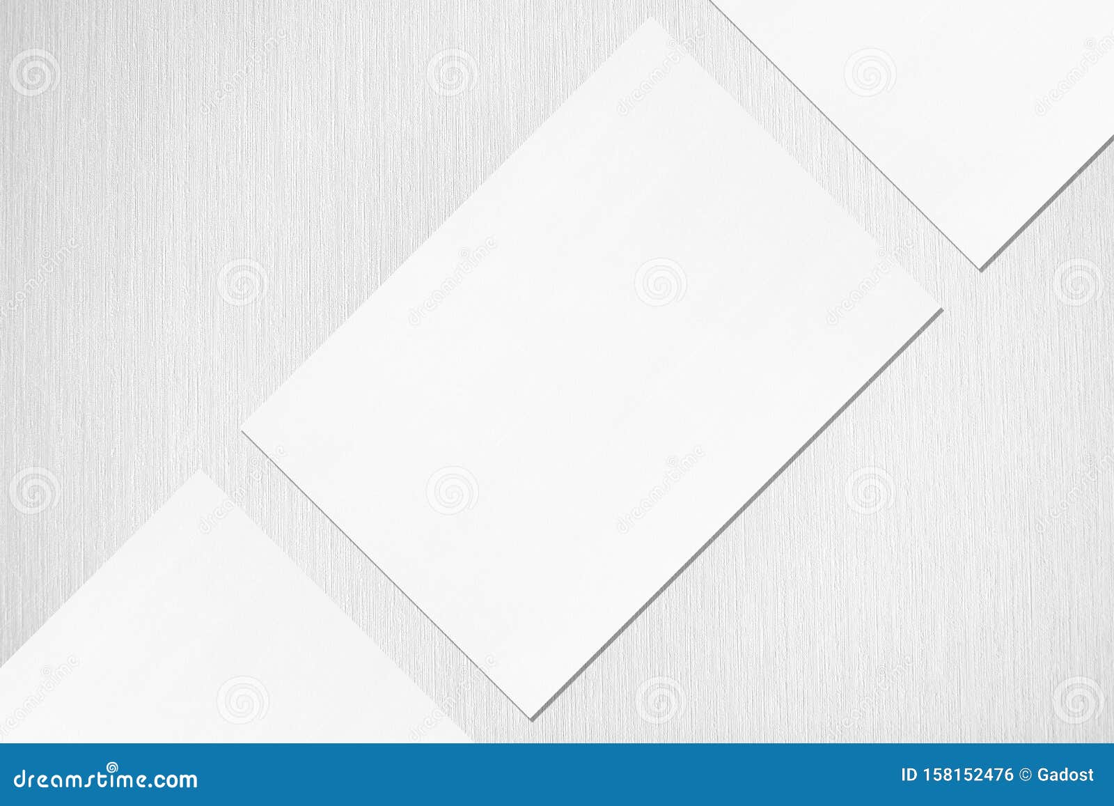 Closeup of Three Empty White Rectangle Poster Mockups Lying Diagonally ...