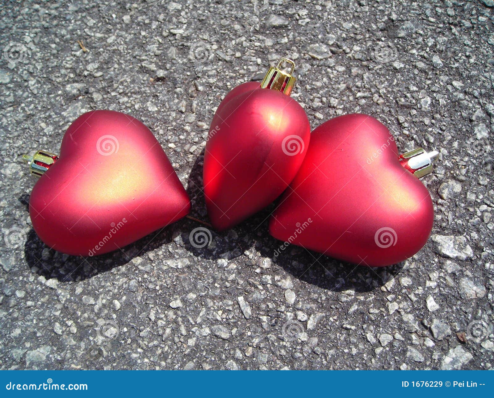 Closeup of three hearts stock image. Image of intrude - 1676229
