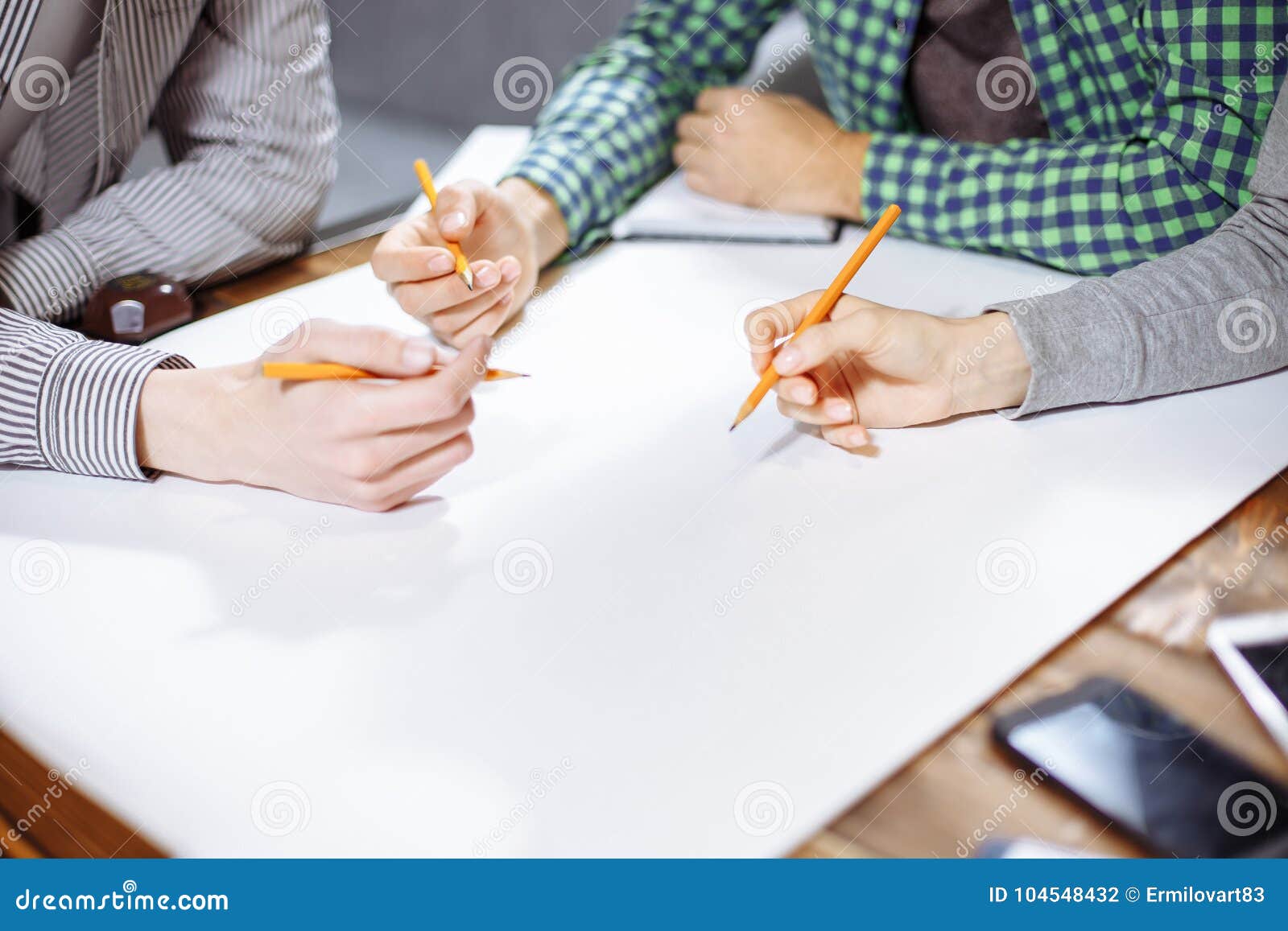 Closeup of Three Pairs of Hands Working on a New Project. the Drawing ...