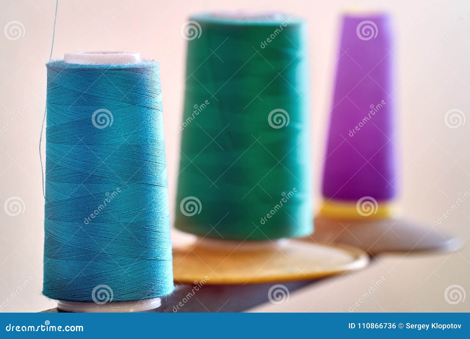 Closeup of Three Threadlike Coils for Industrial Sewing Machine Stock ...