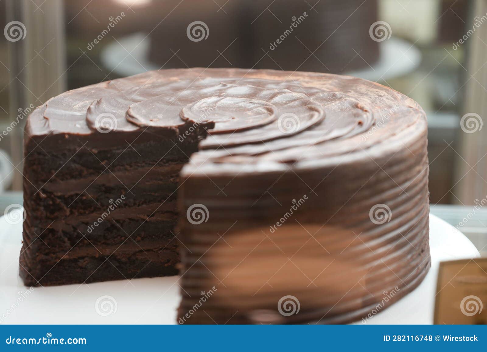 Closeup of a Three-tier Chocolate Cake Stock Photo - Image of luscious ...