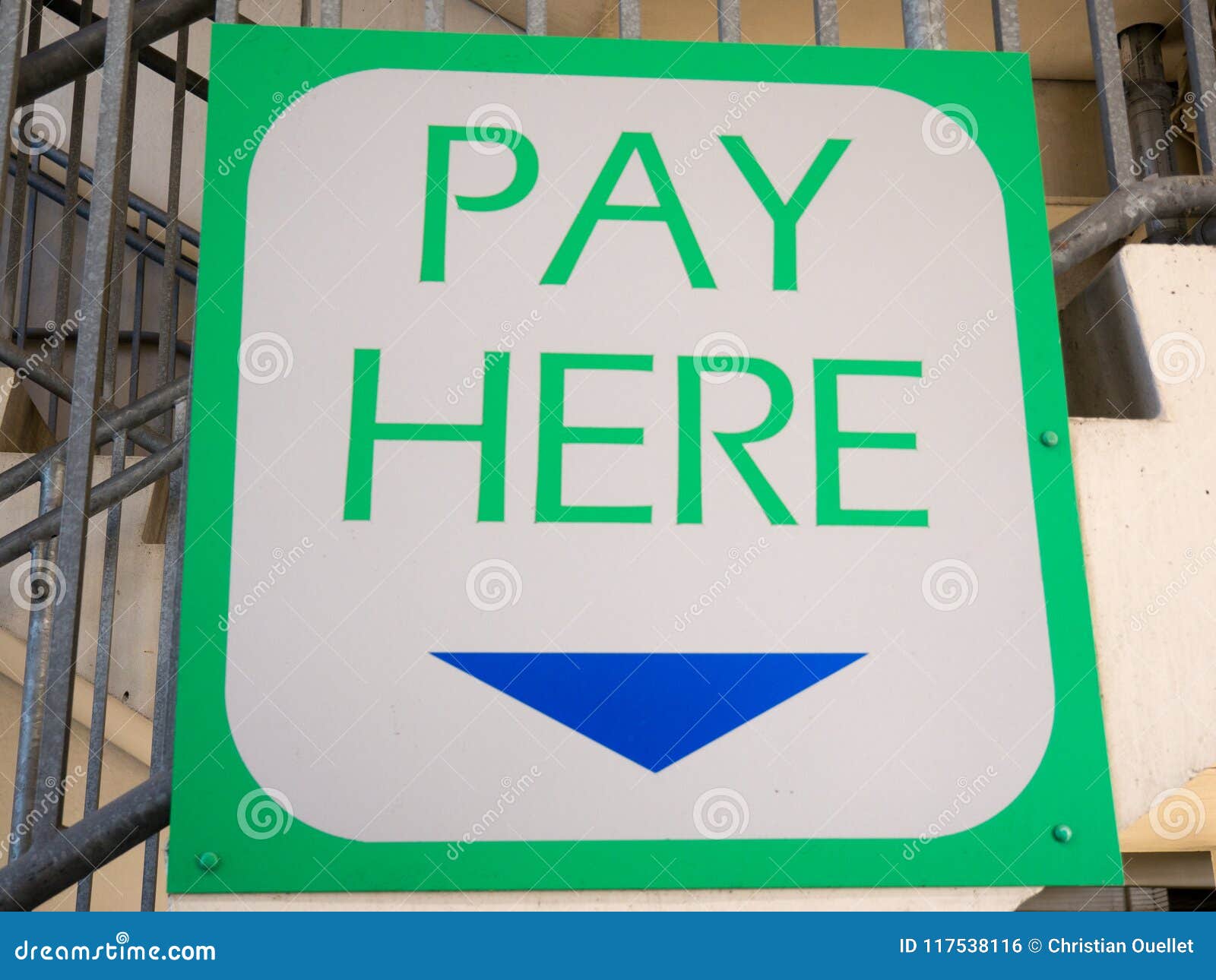 Closeup to a Pay Here sign stock photo. Image of payment - 117538116