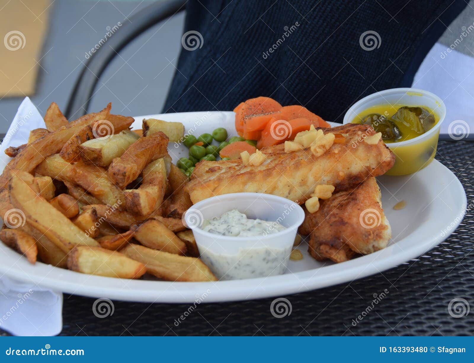 Fish and chip dinner plate stock photo. Image of dinner - 163393480