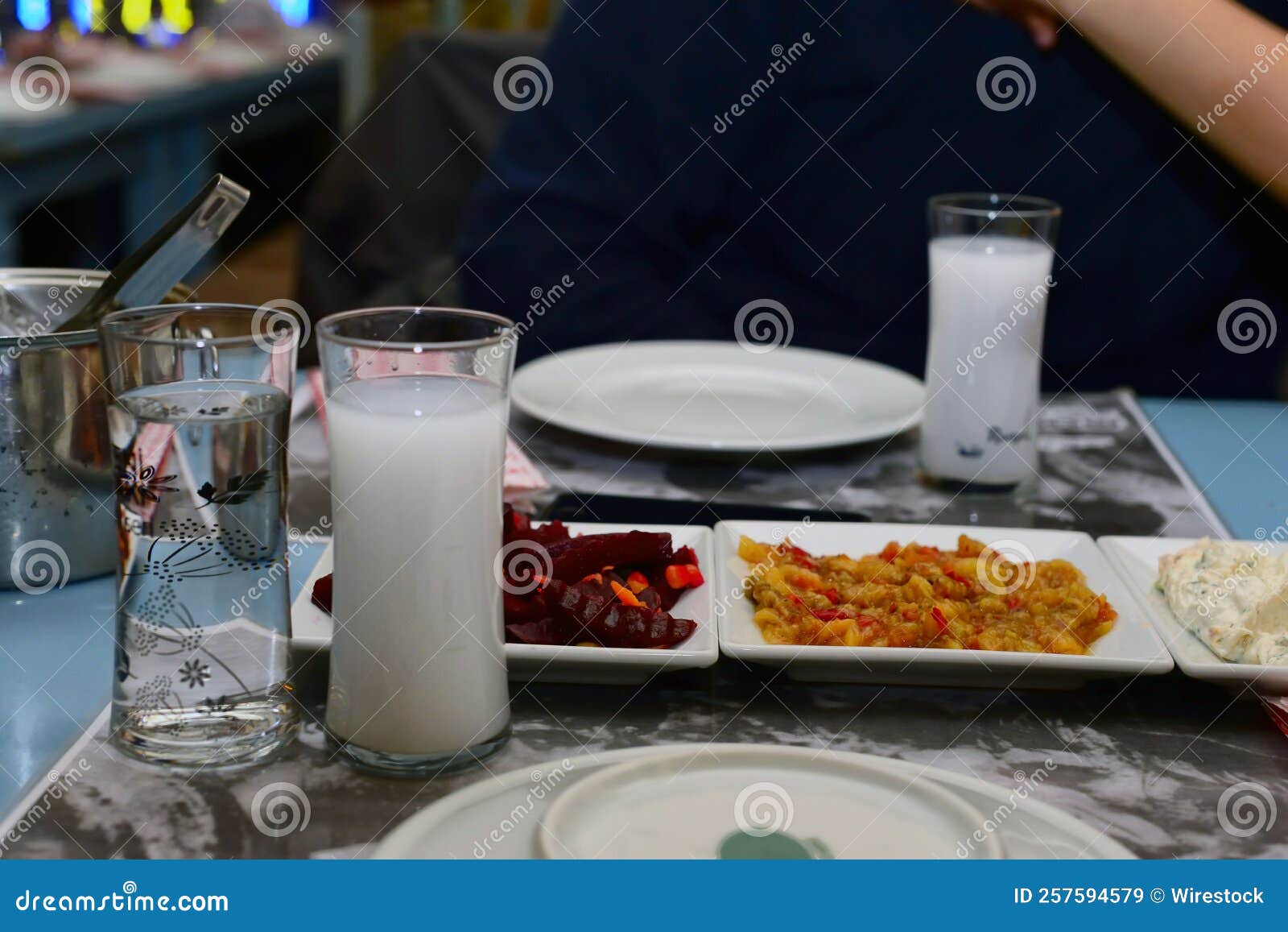 Turkish Raki With Water On Table With Sliced Melon And Appetizer ...