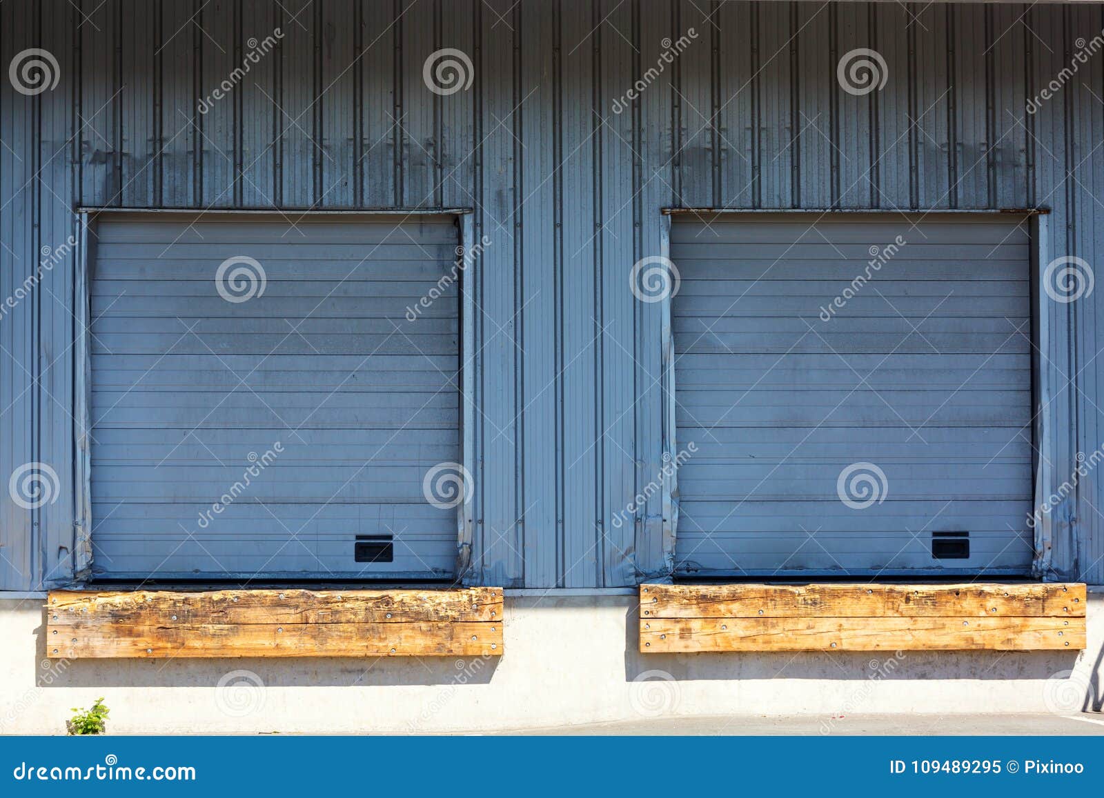 Closeup of Two Closed Shutter on a Loading Dock Stock Image - Image of ...