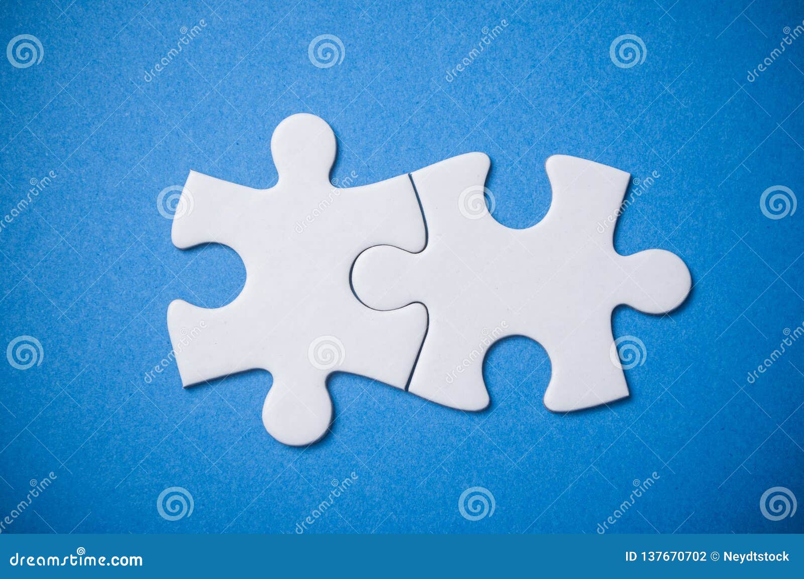 Two Connected Jigsaw Puzzle Pieces on Blue Background. the Concept of ...