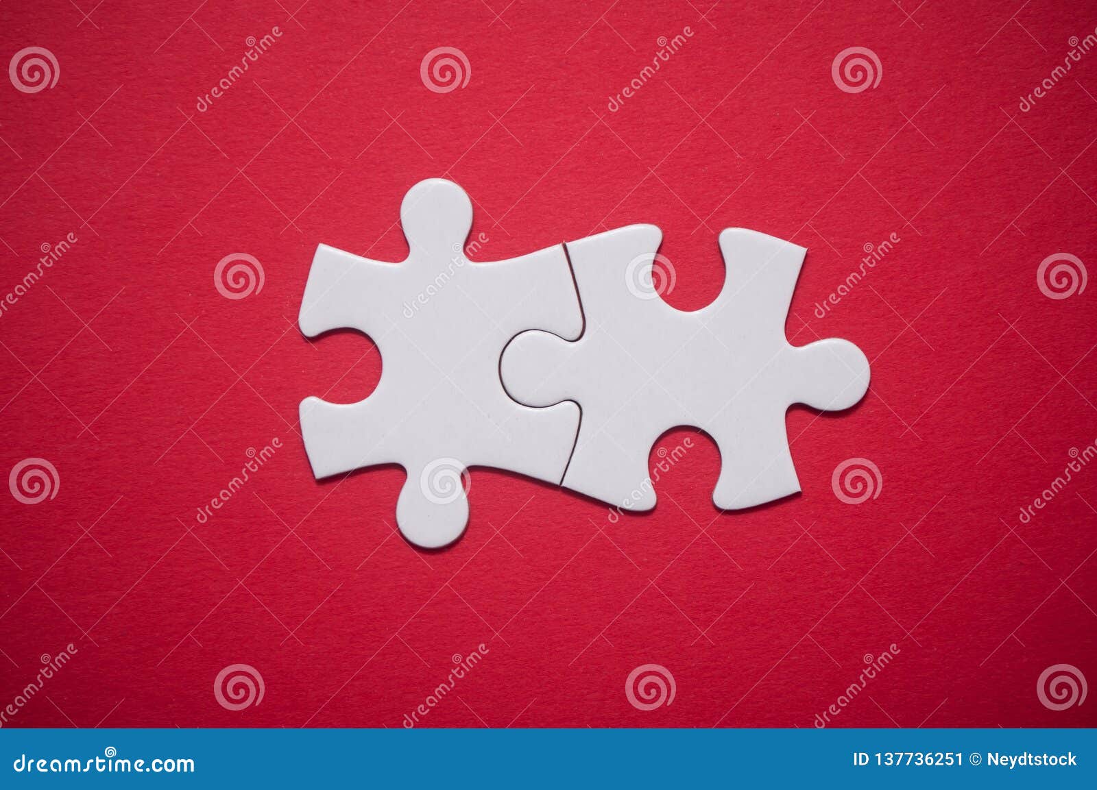 Two Connected Jigsaw Puzzle Pieces on Red Background. the Concept of ...