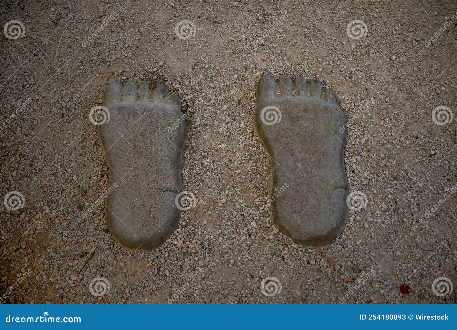 Closeup of Two Feet Shaped Stepping Stones on a Beach Stock Image ...
