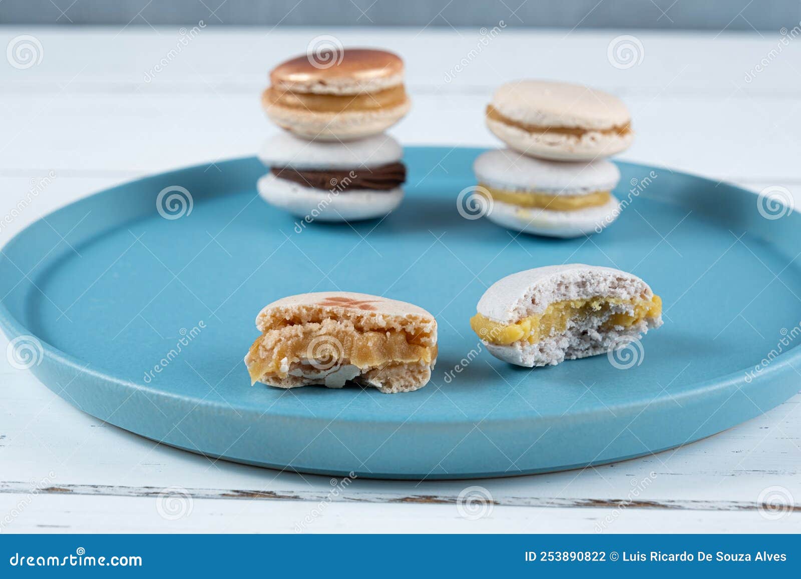 Closeup of Two Macarons with Bites. in the Blurred Background, Pile of ...