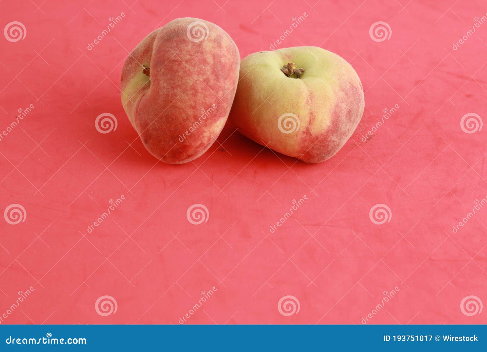 Closeup of Two Peaches on a Bright Red Surface Stock Image - Image of ...