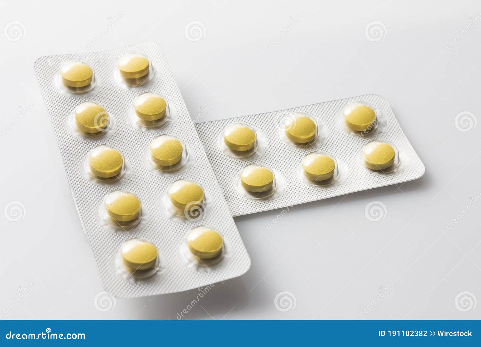 Closeup of Two Pill Tablets Isolated on a White Surface Stock Photo ...