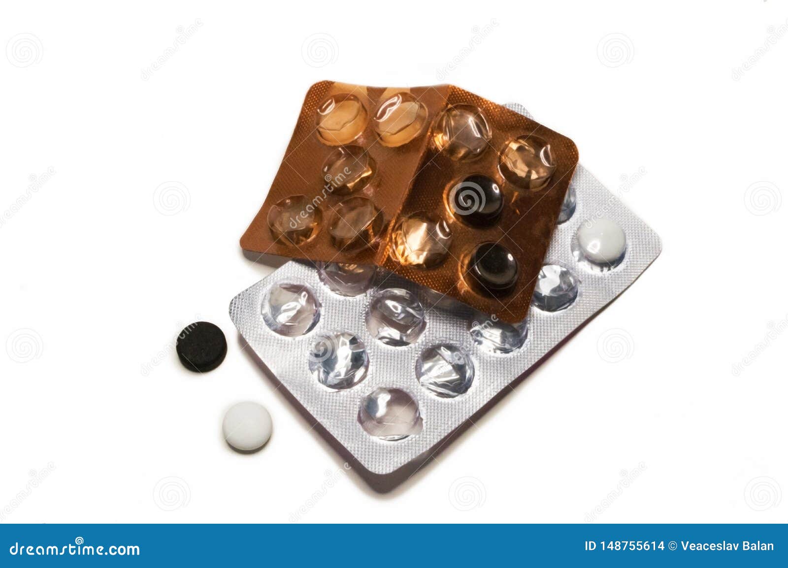 Closeup of Two Types of Tablets Unpacked and Rumpled on a White ...