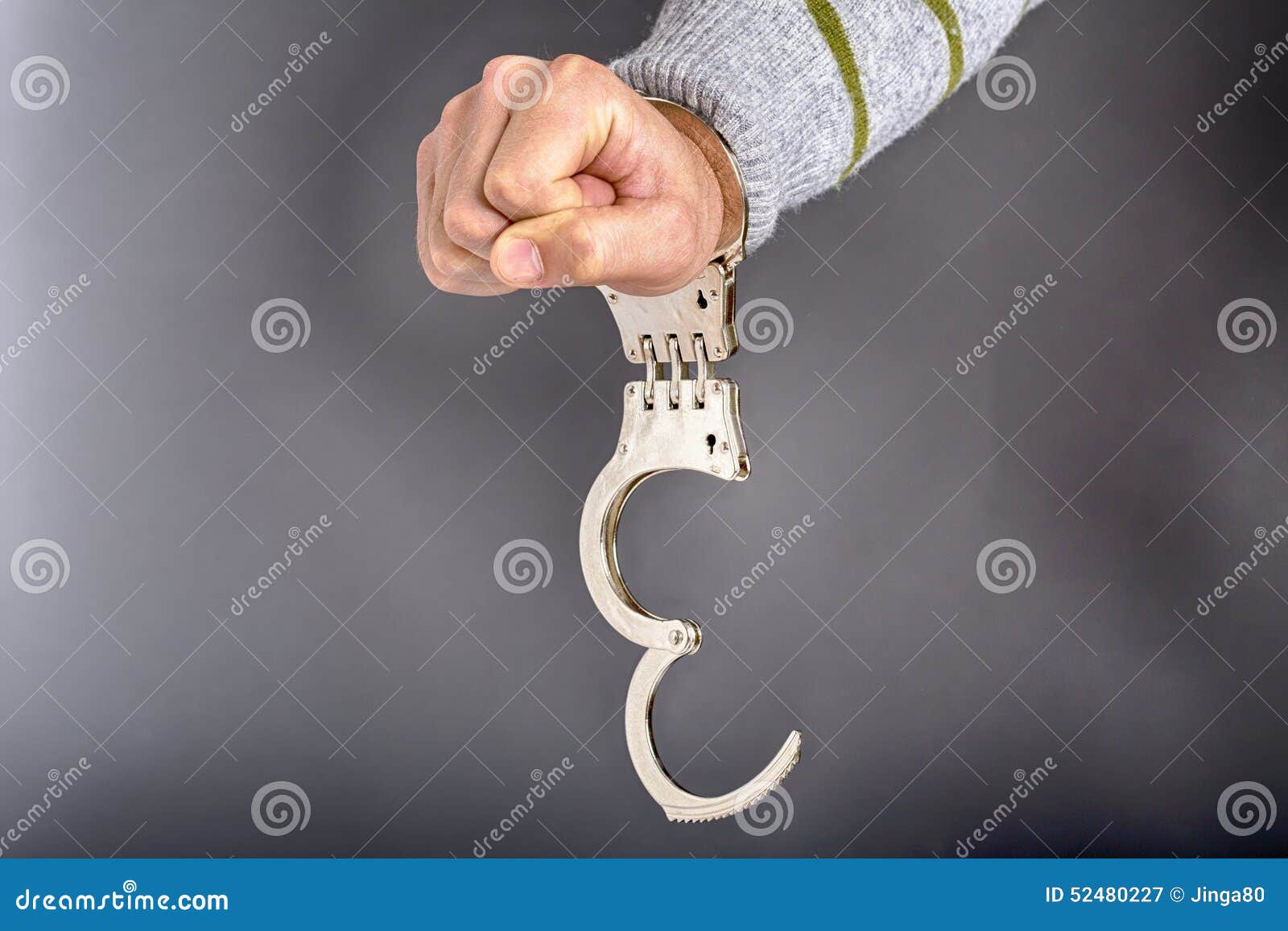 Closeup of Unlocked Handcuffs Hanging on Man Hand Stock Image - Image ...