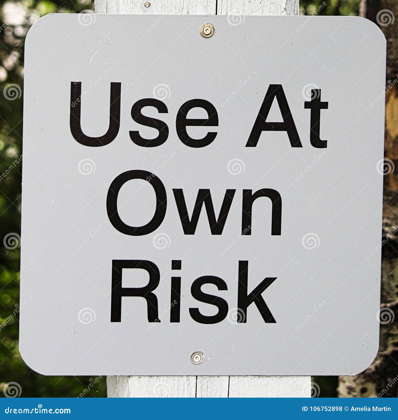 Closeup of a Use at Own Risk Sign Stock Photo - Image of guide ...