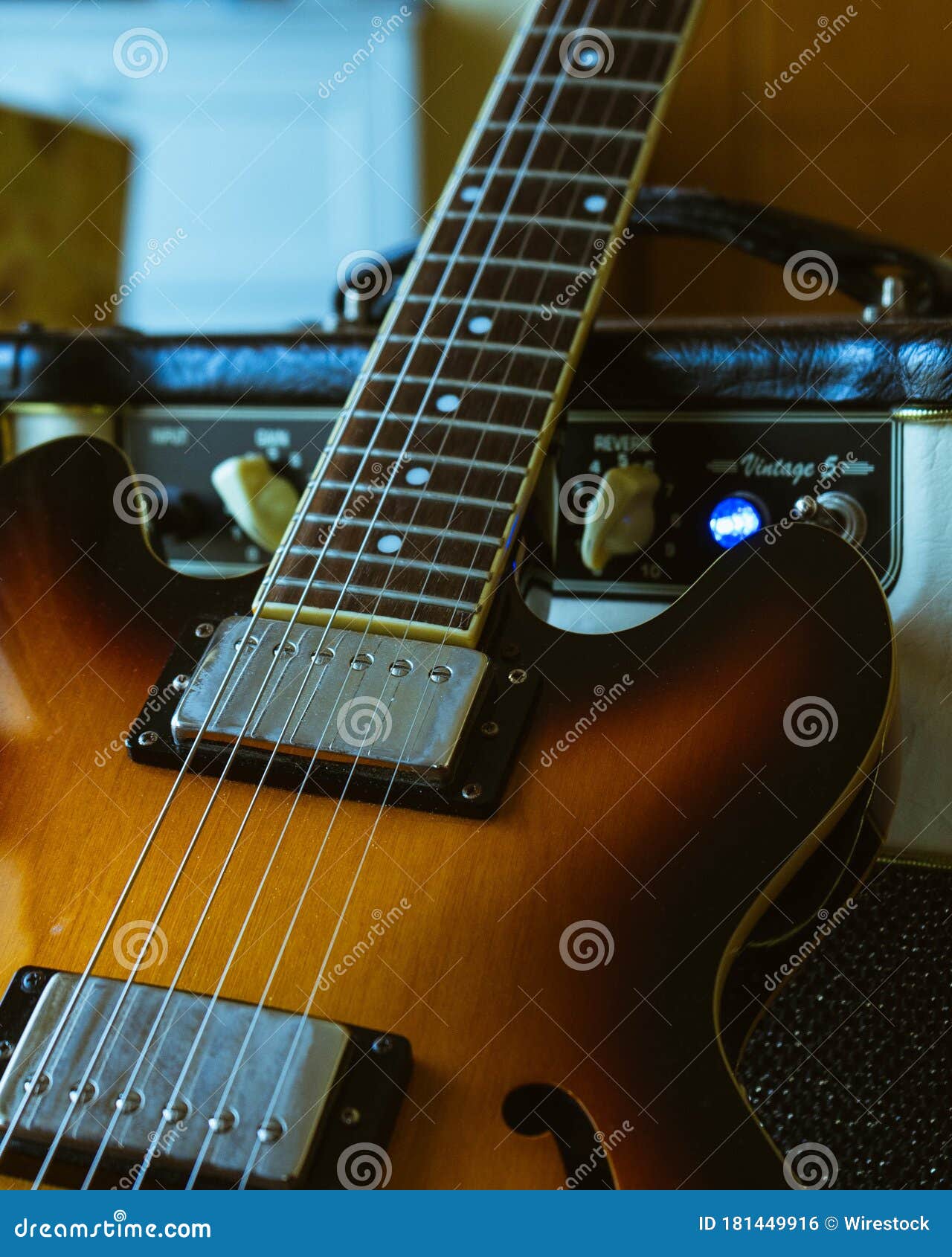 Closeup Vertical Shot of a Brown Electronic Guitar Stock Photo - Image ...