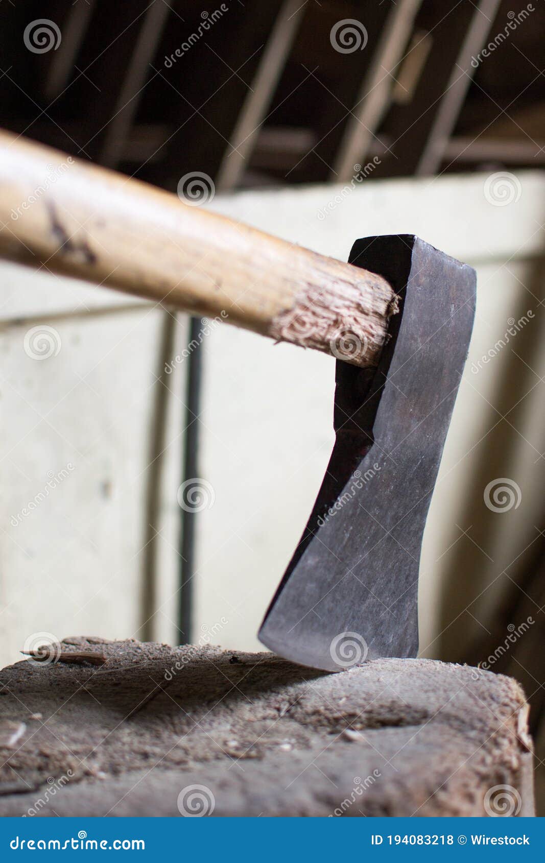 Closeup Vertical Shot of a Chopping Ax with a White Plank on the ...