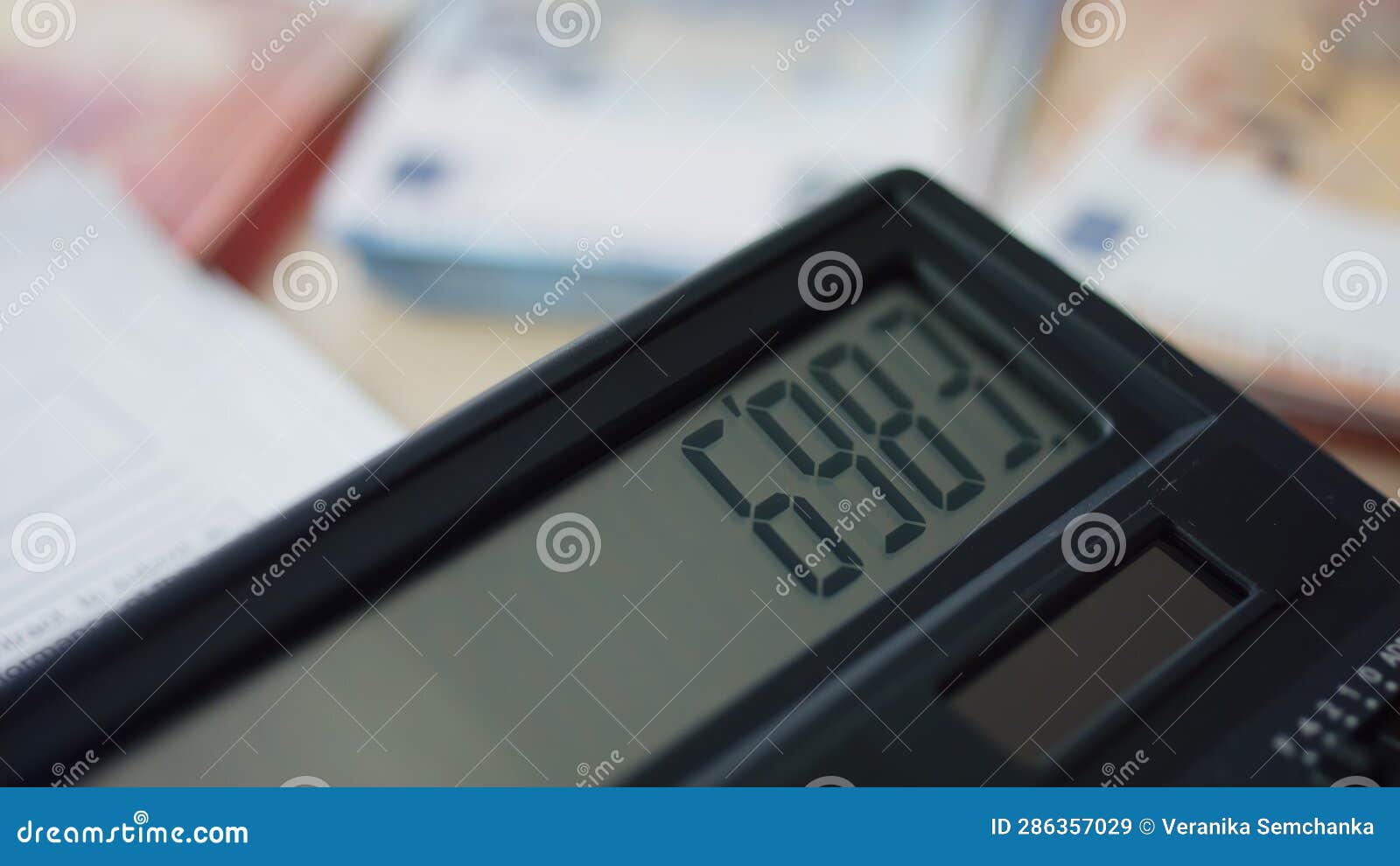 Closeup View Calculator Display with Calculations. Numbers Appearing on ...
