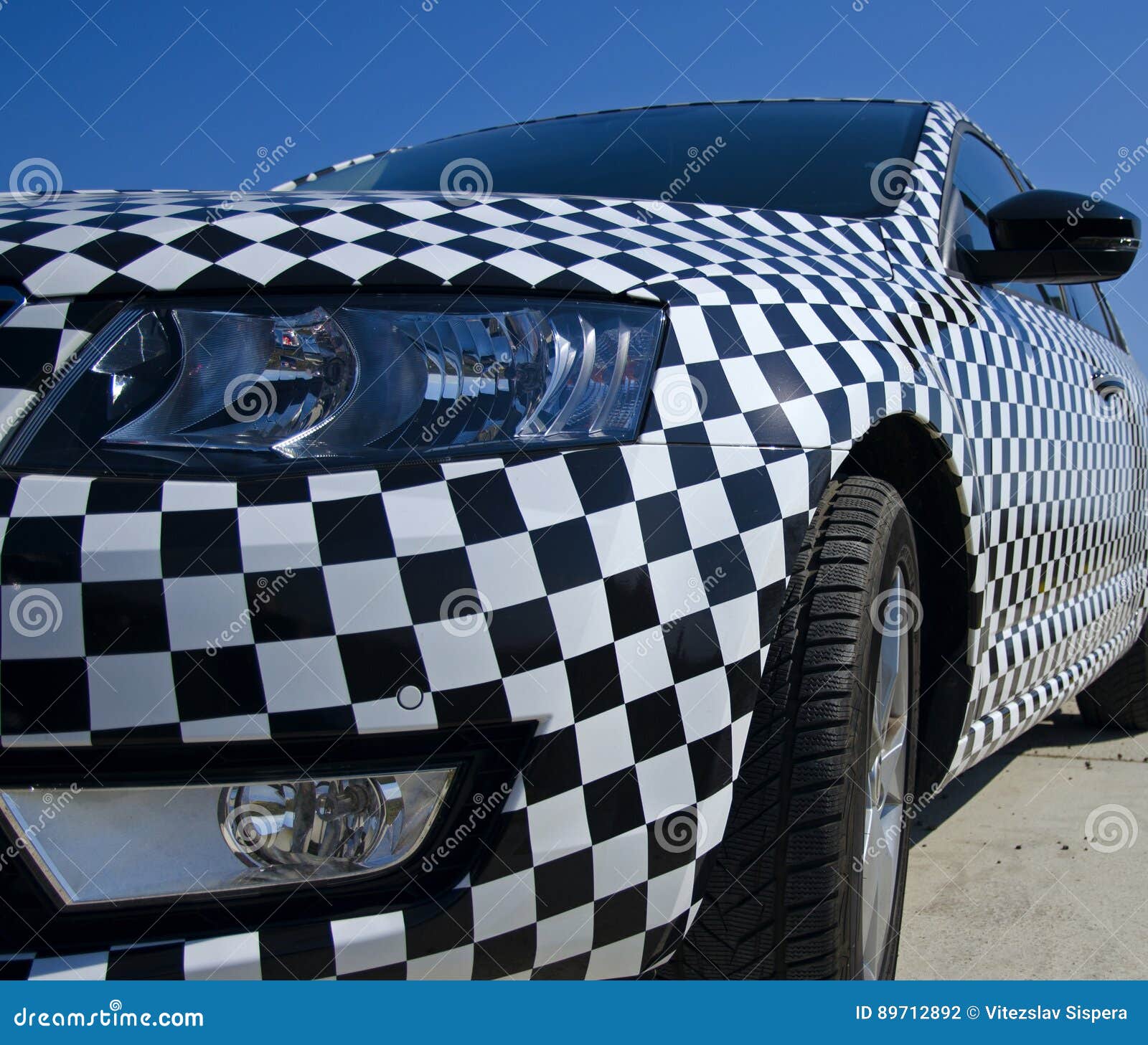 Closeup View of the Car Checkerboard Pattern with Detail Headlight and ...