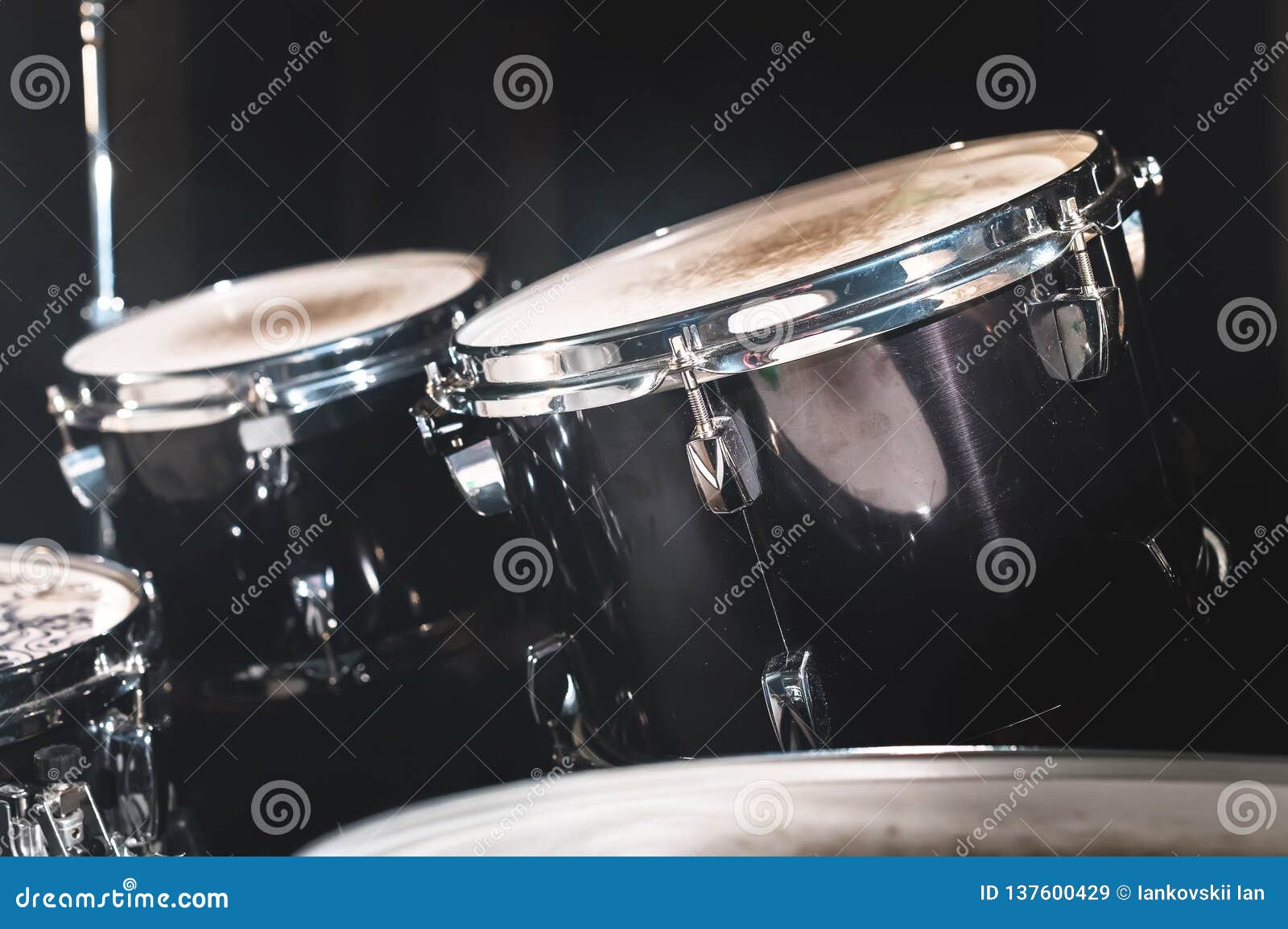 Closeup View of a Drum Set in a Dark Studio. Black Drum Barrels with ...