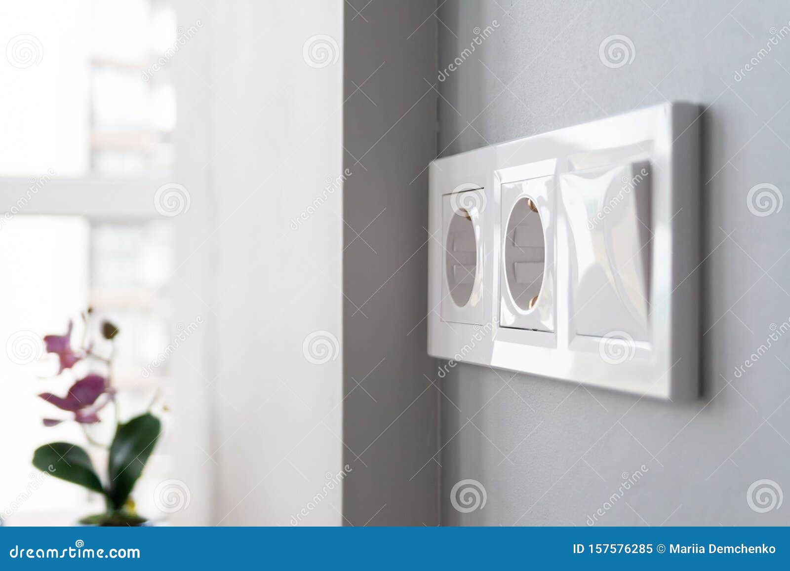 A Closeup View of a Group of White European Electrical Outlets and a ...