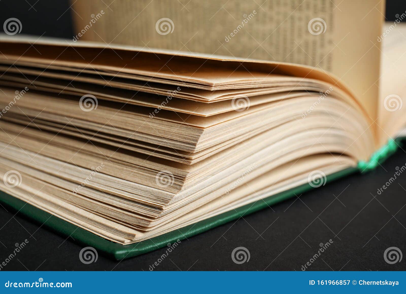 Closeup View of Open Book on Black Stock Image - Image of knowledge ...