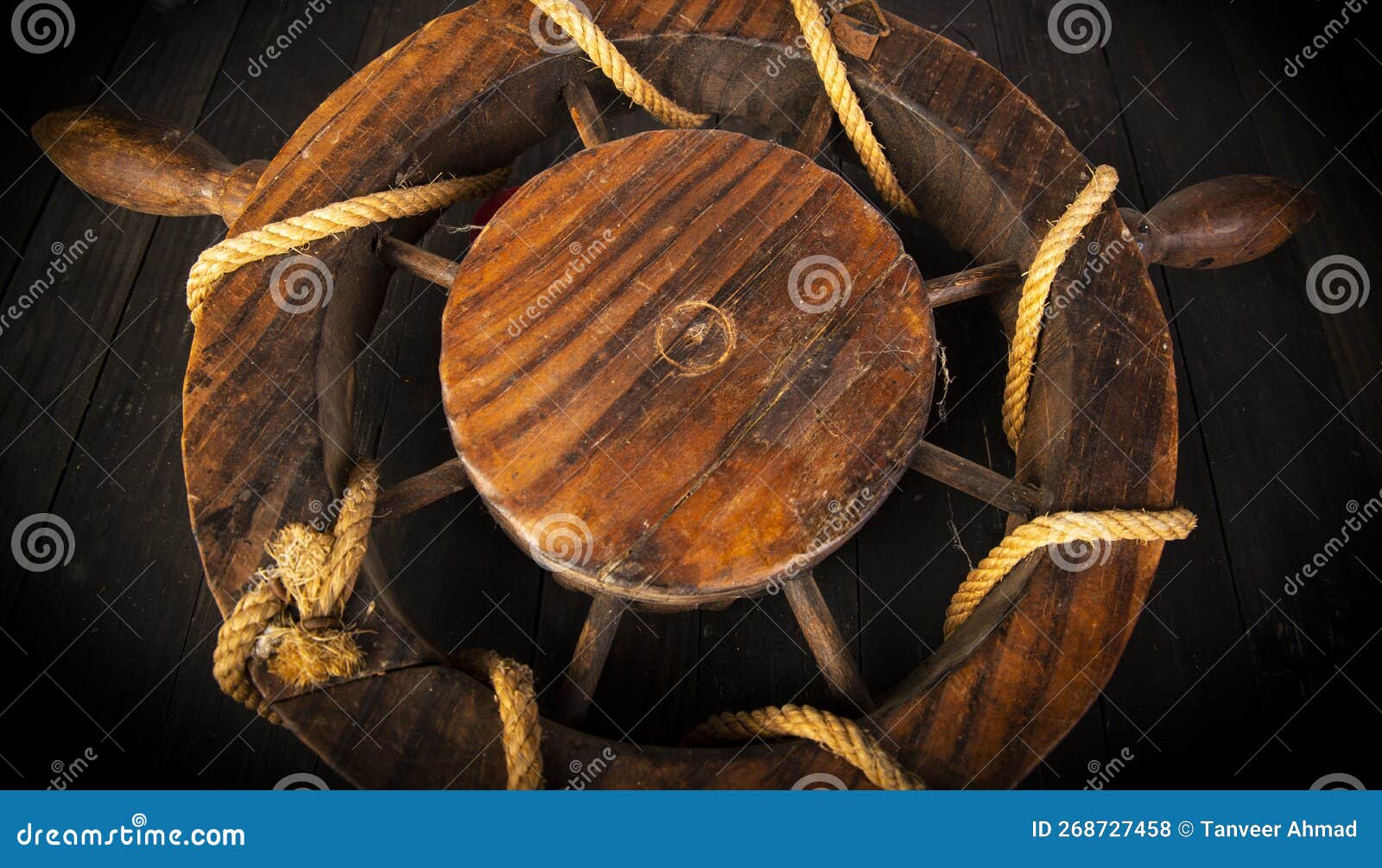 Closeup View of Vintage Ship Wheel with Ropes Around Stock Photo ...