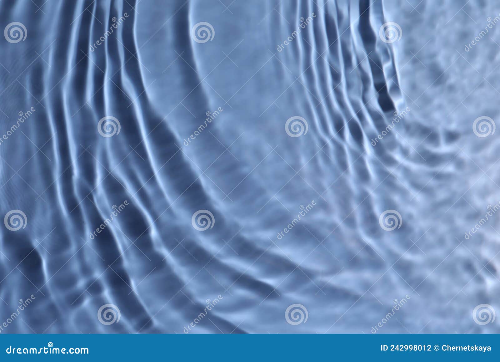 Closeup View of Water with Rippled Surface on Blue Background Stock ...