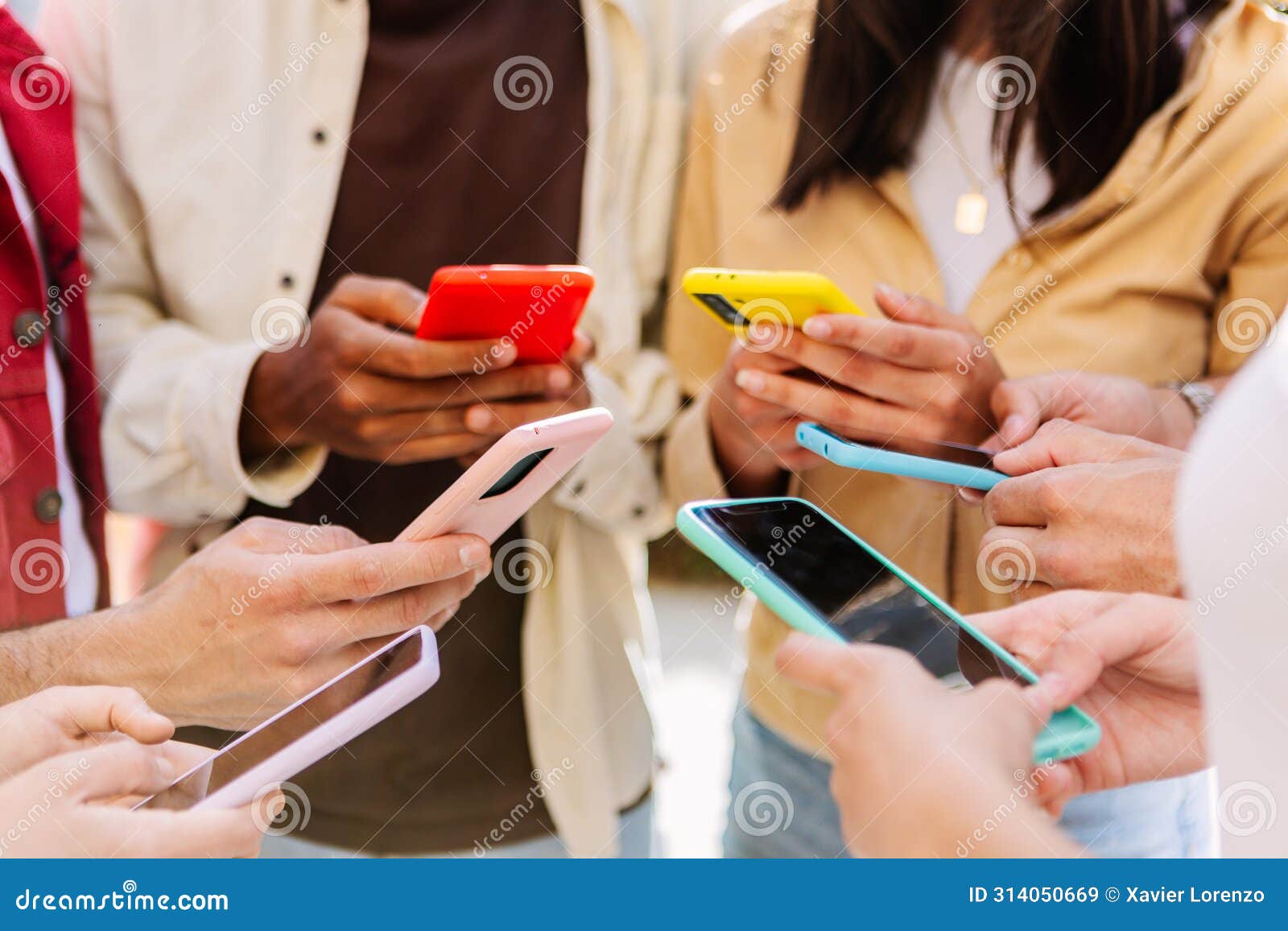 Closeup View of Young Group of People Hands Using Mobile Phone Outdoors ...