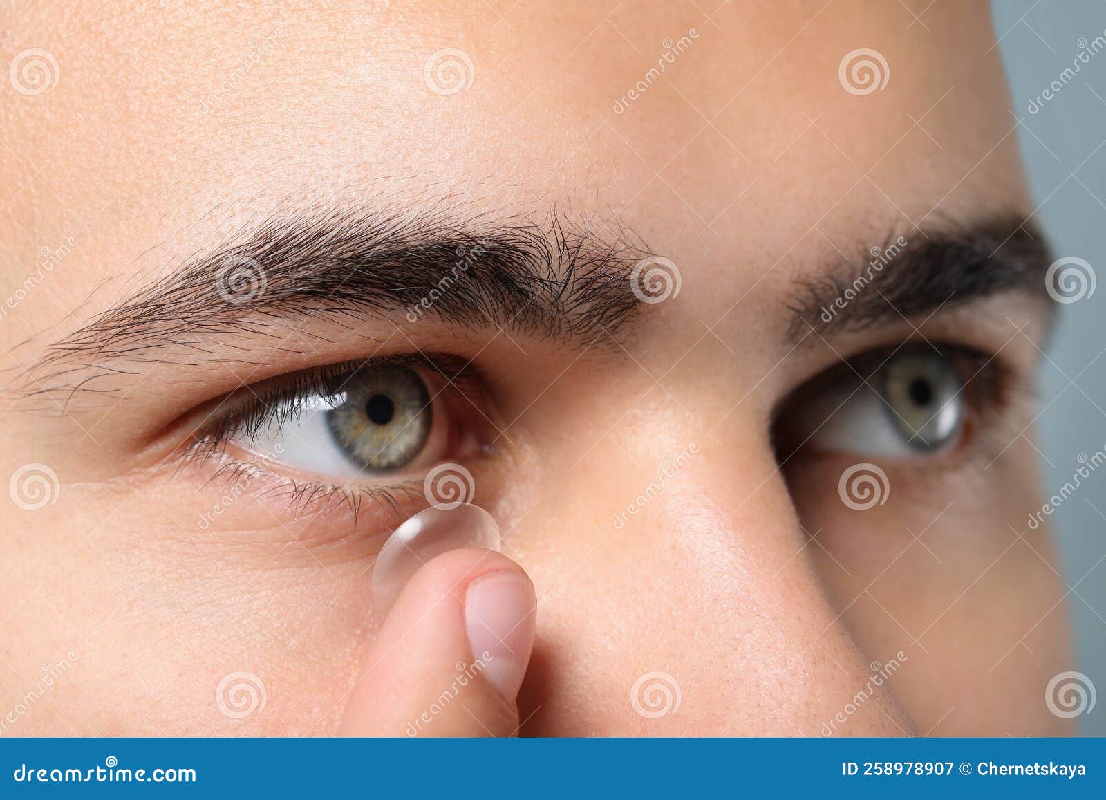 Closeup View of Young Man Putting in Contact Lens Stock Image - Image ...