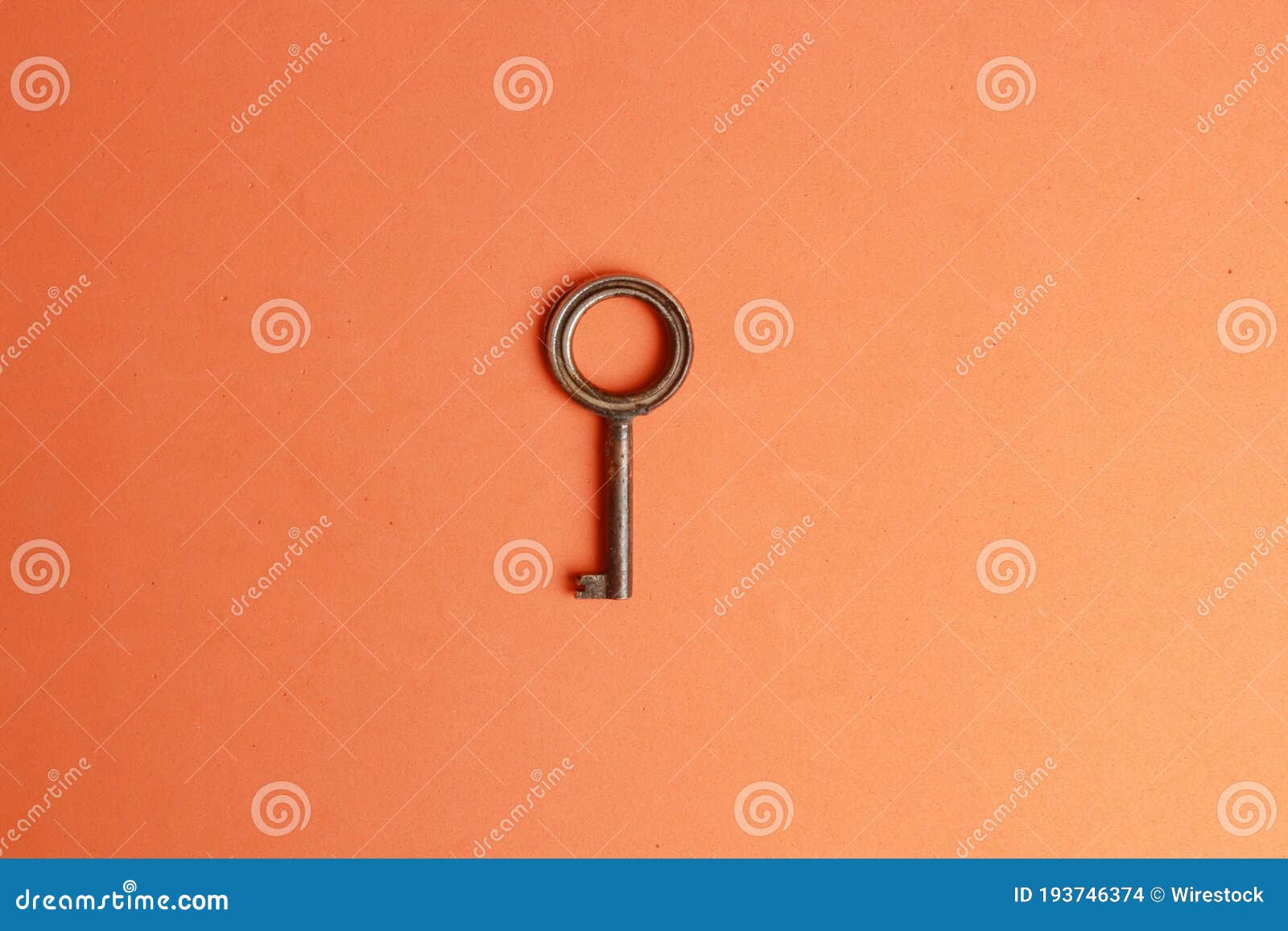 Closeup of a Vintage Key on Orange Background - a Concept on Security ...