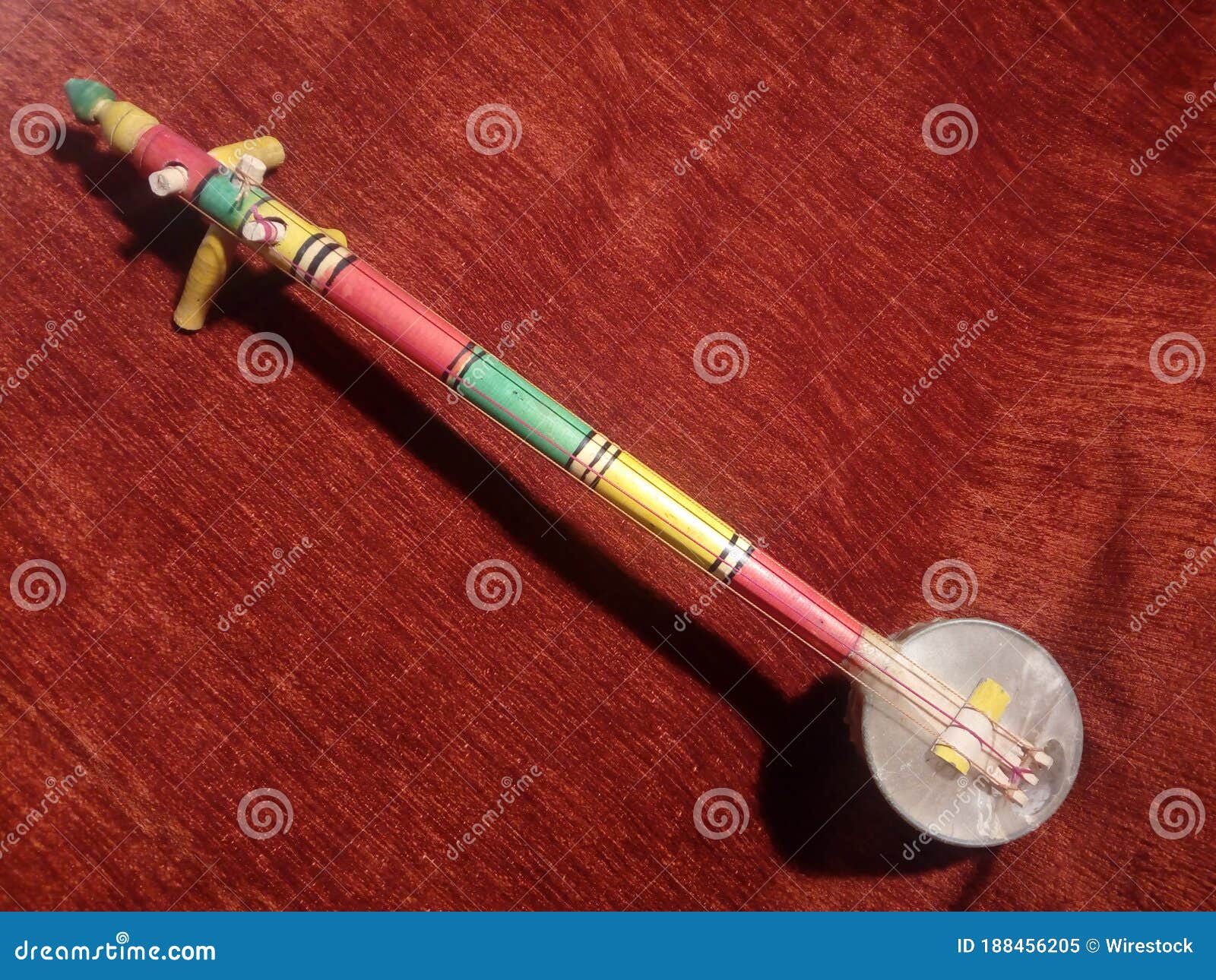 Closeup of a Vintage Moroccan Lute Instrument on a Red Surface Stock ...