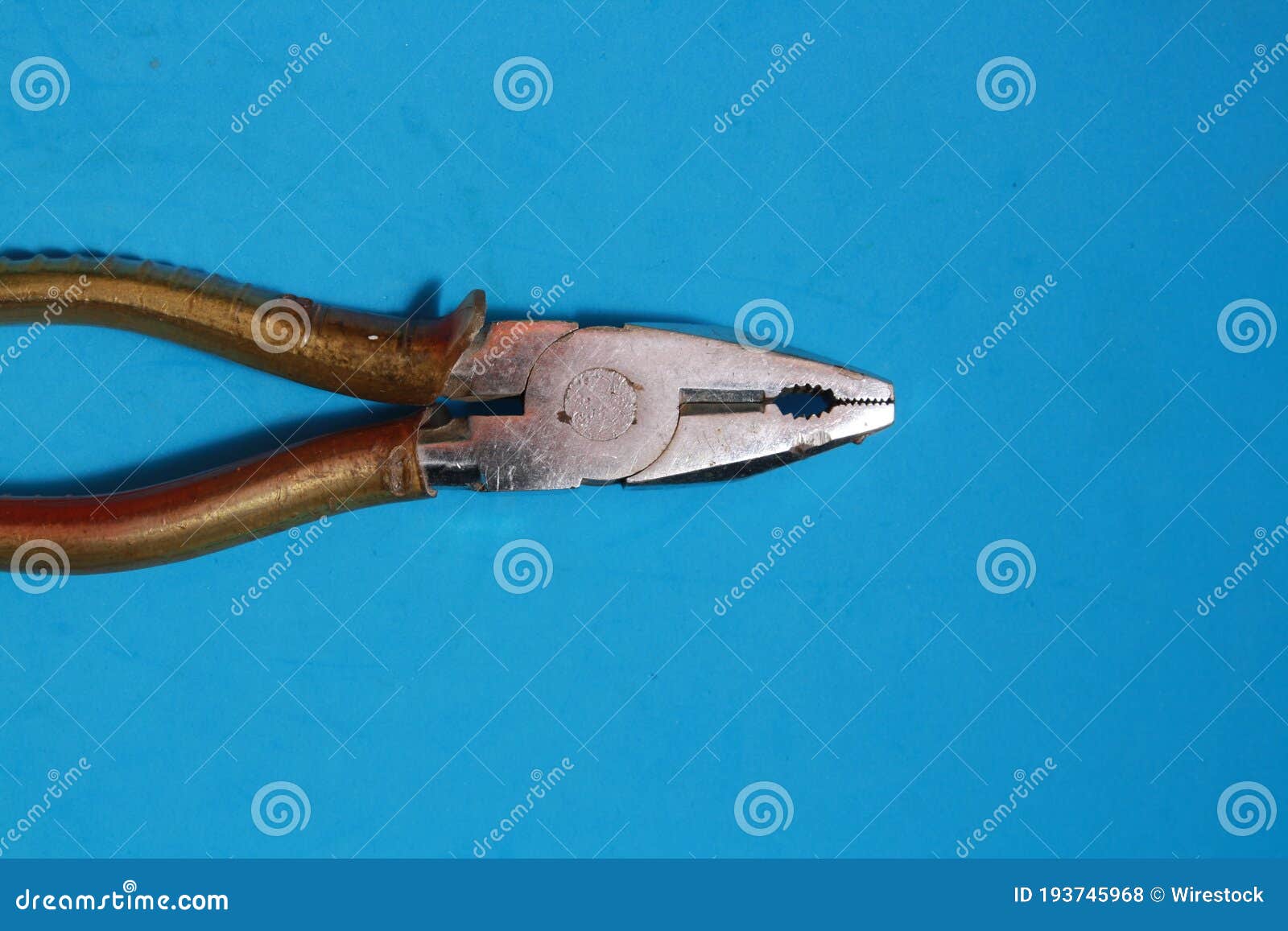 Closeup of Vintage Pliers Isolated on a Blue Background Stock Photo ...
