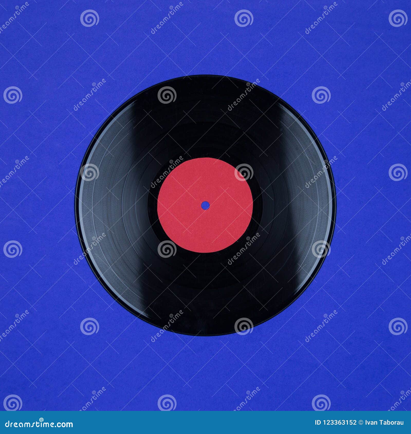 Closeup of Vinyl Long Play Record with Label with Copy Space on Blue ...