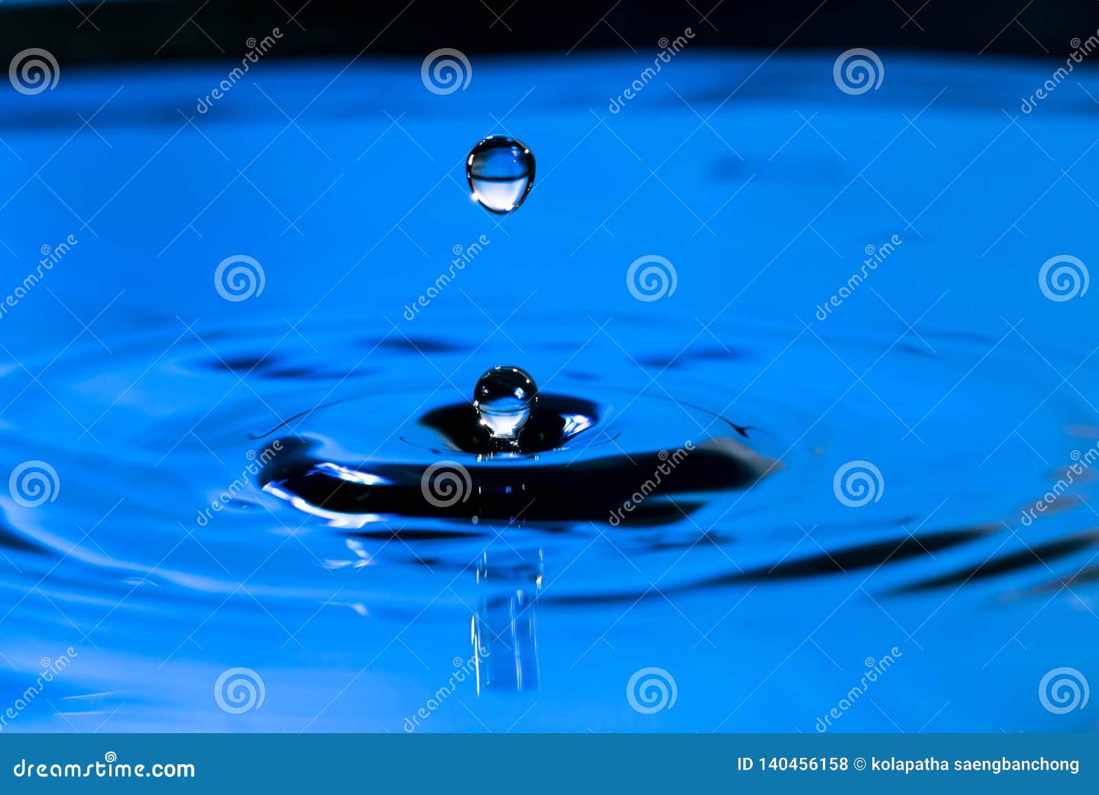 Closeup Water Drop Falling and Dripping from the Top To the Surface of ...