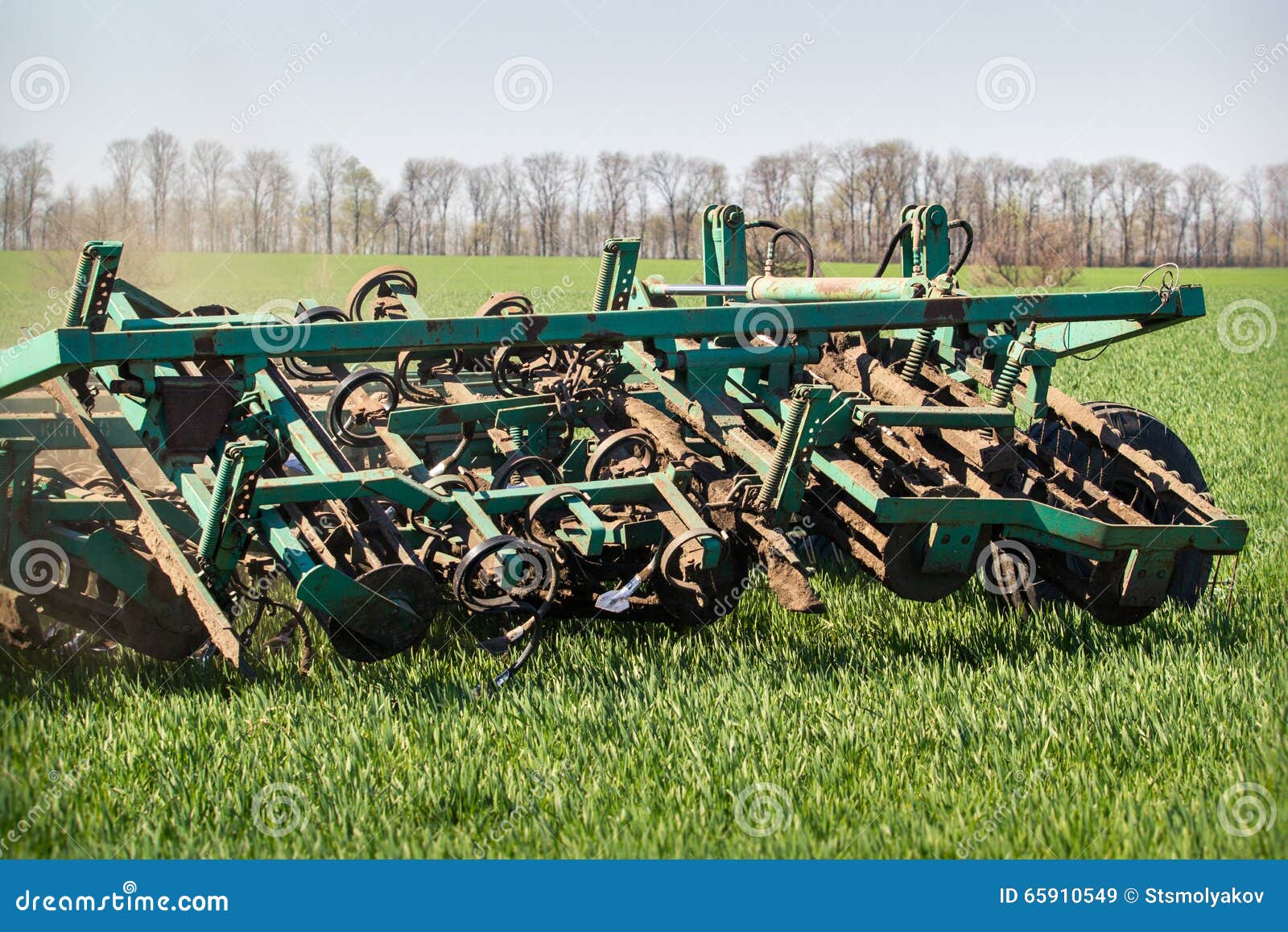 Closeup Weeding-machine Behind Tractor on Green Wheat Field Stock Image ...